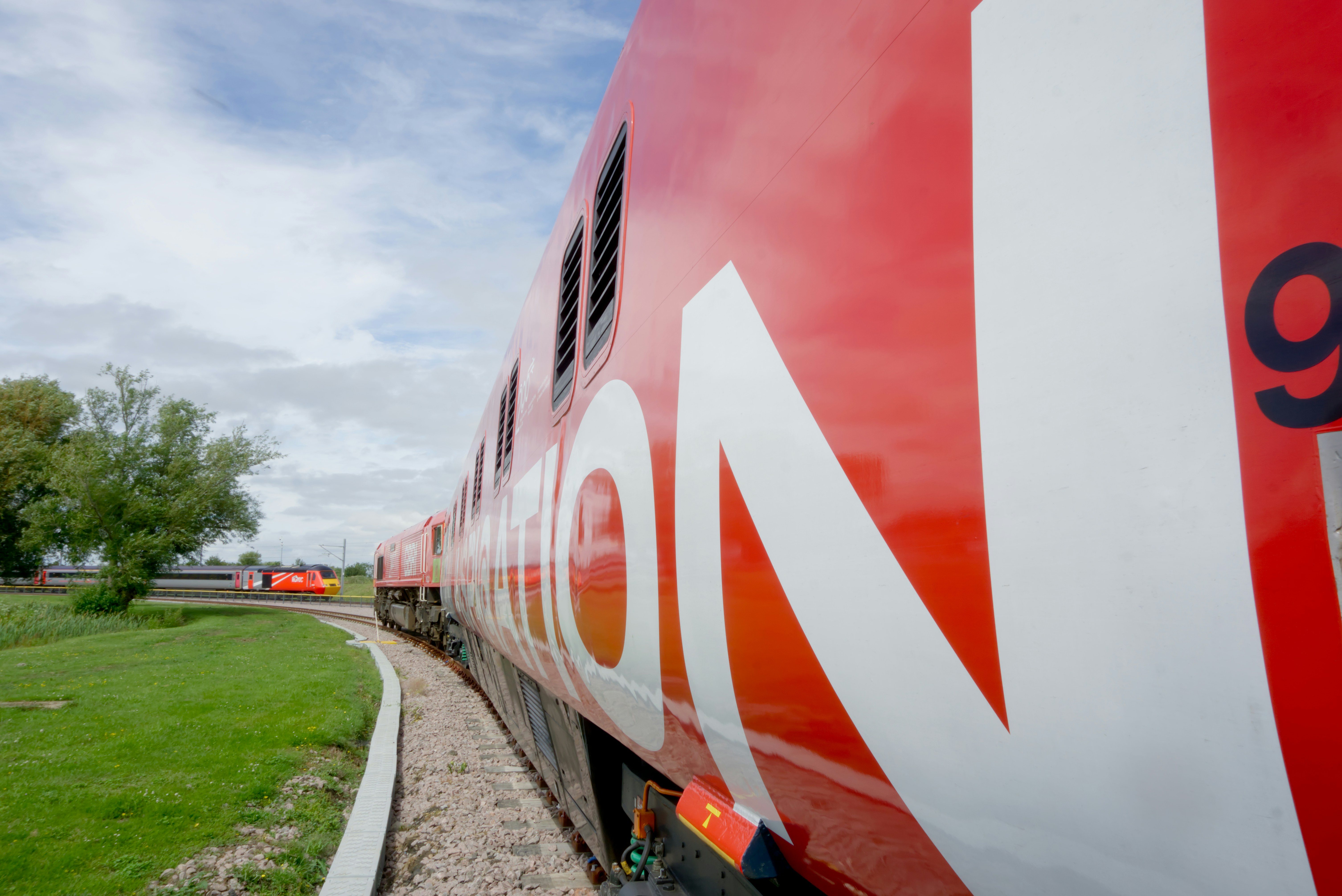 Red Monolith on Rails: A Long Shot Along the Freight Line