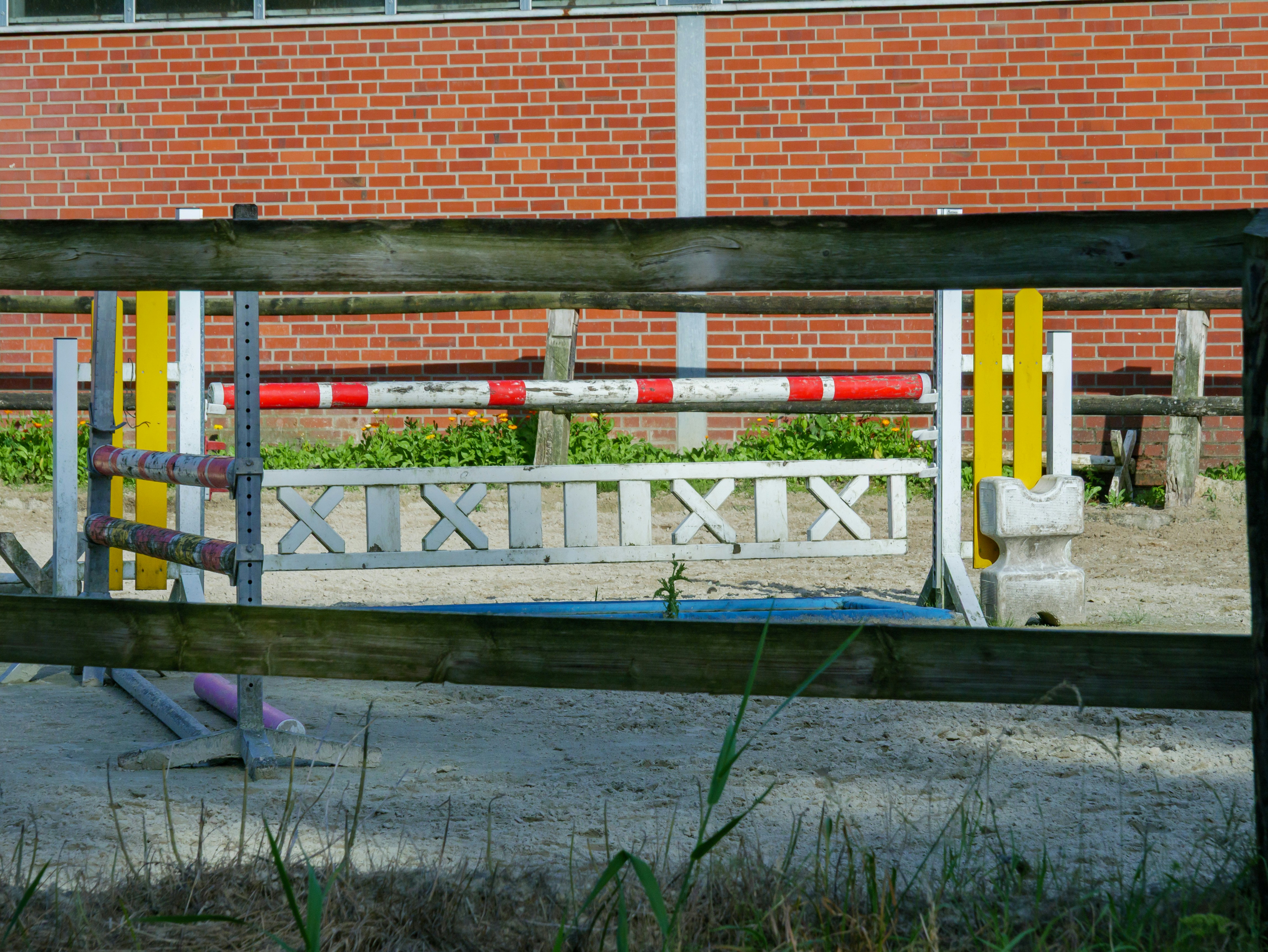 Under the Jump Bar: A Quiet Ride Overlooking an Indoor Arena