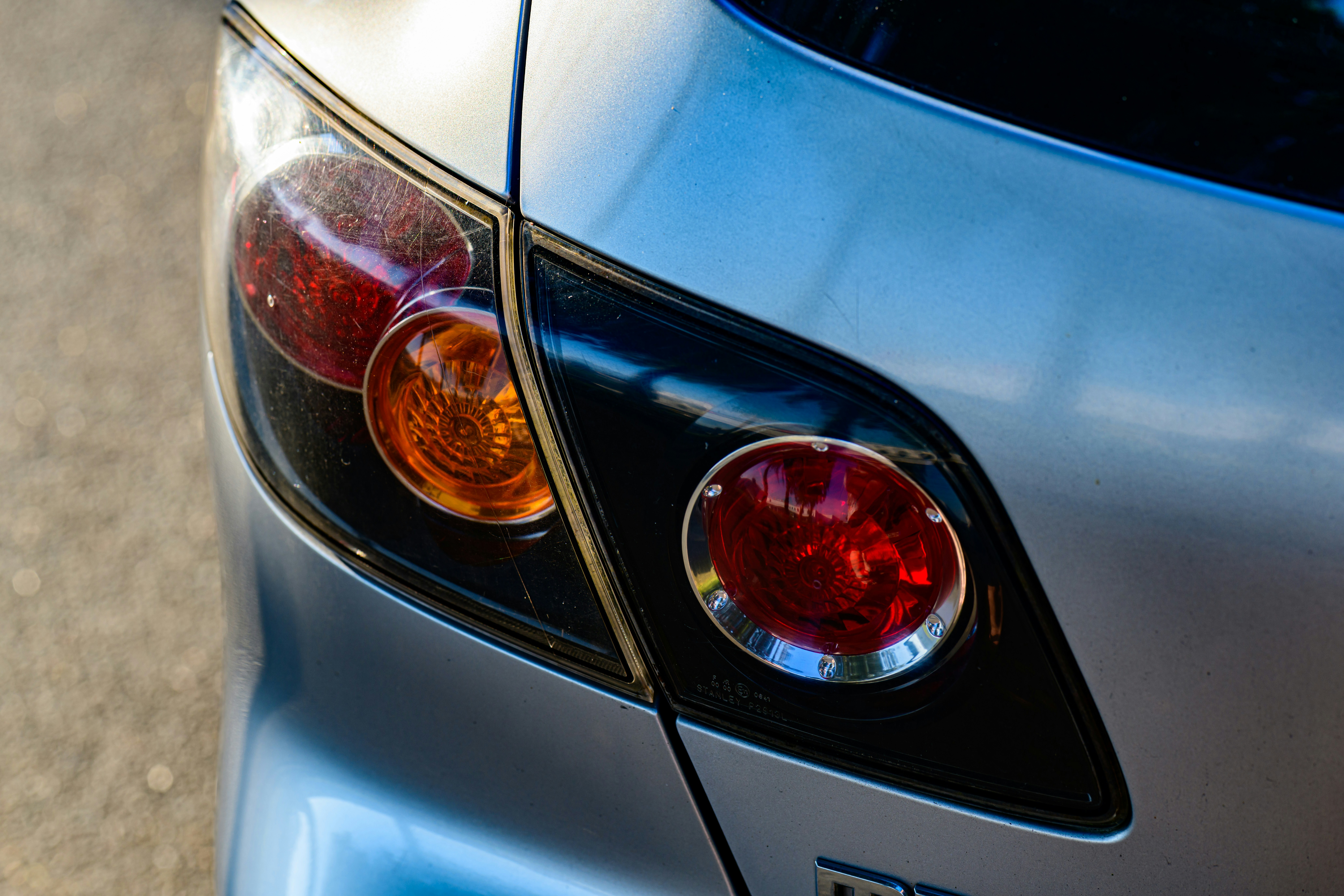 Tail Light Focus: A Metallic Blue Car Portrait