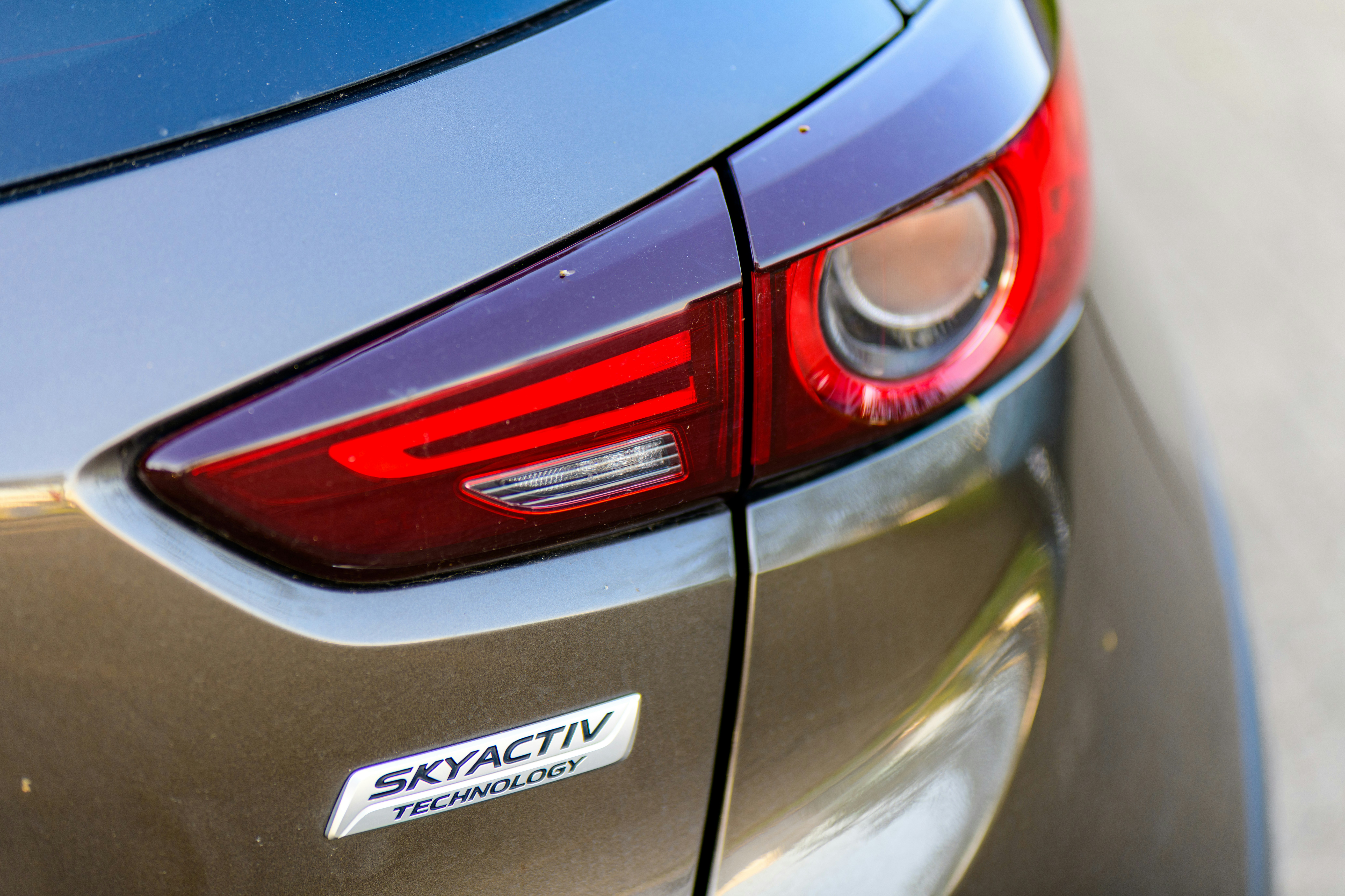 Rear Corner Badge: Skyt Technology on a Metallic SUV