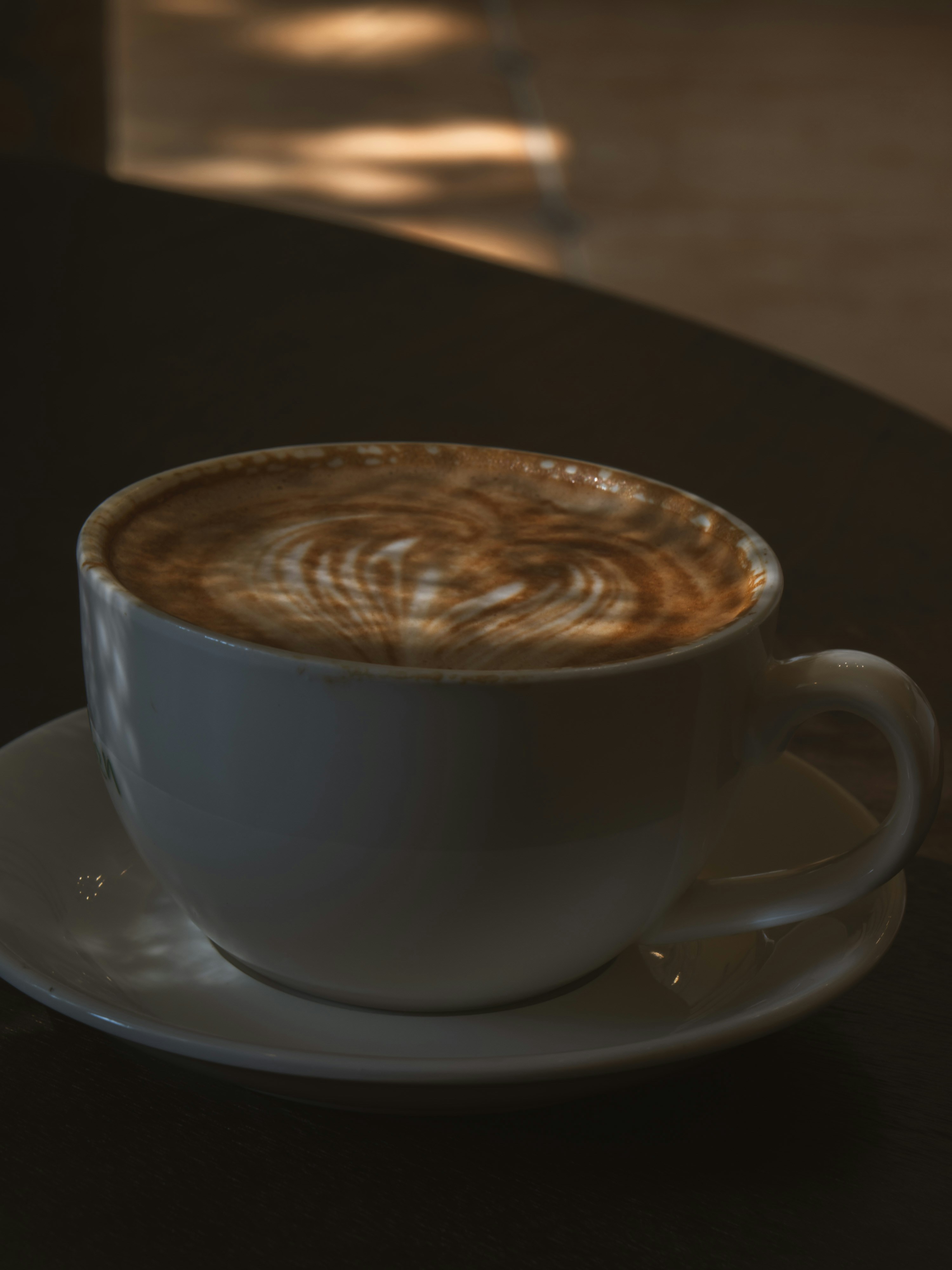 Latte Art in Low Light at a Quiet Café