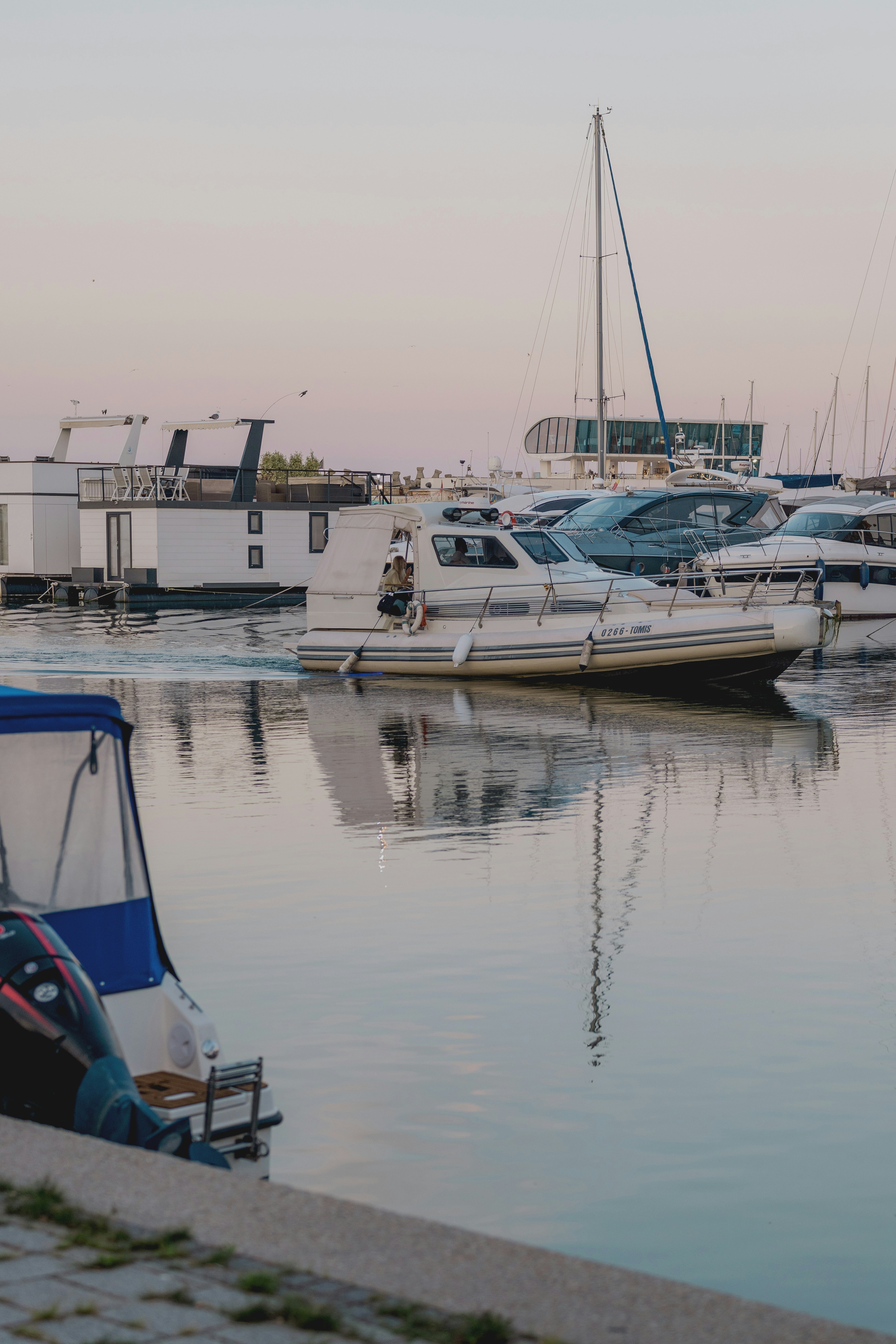 Quiet Evening at the Marina: Boats Rest on Glassy Water