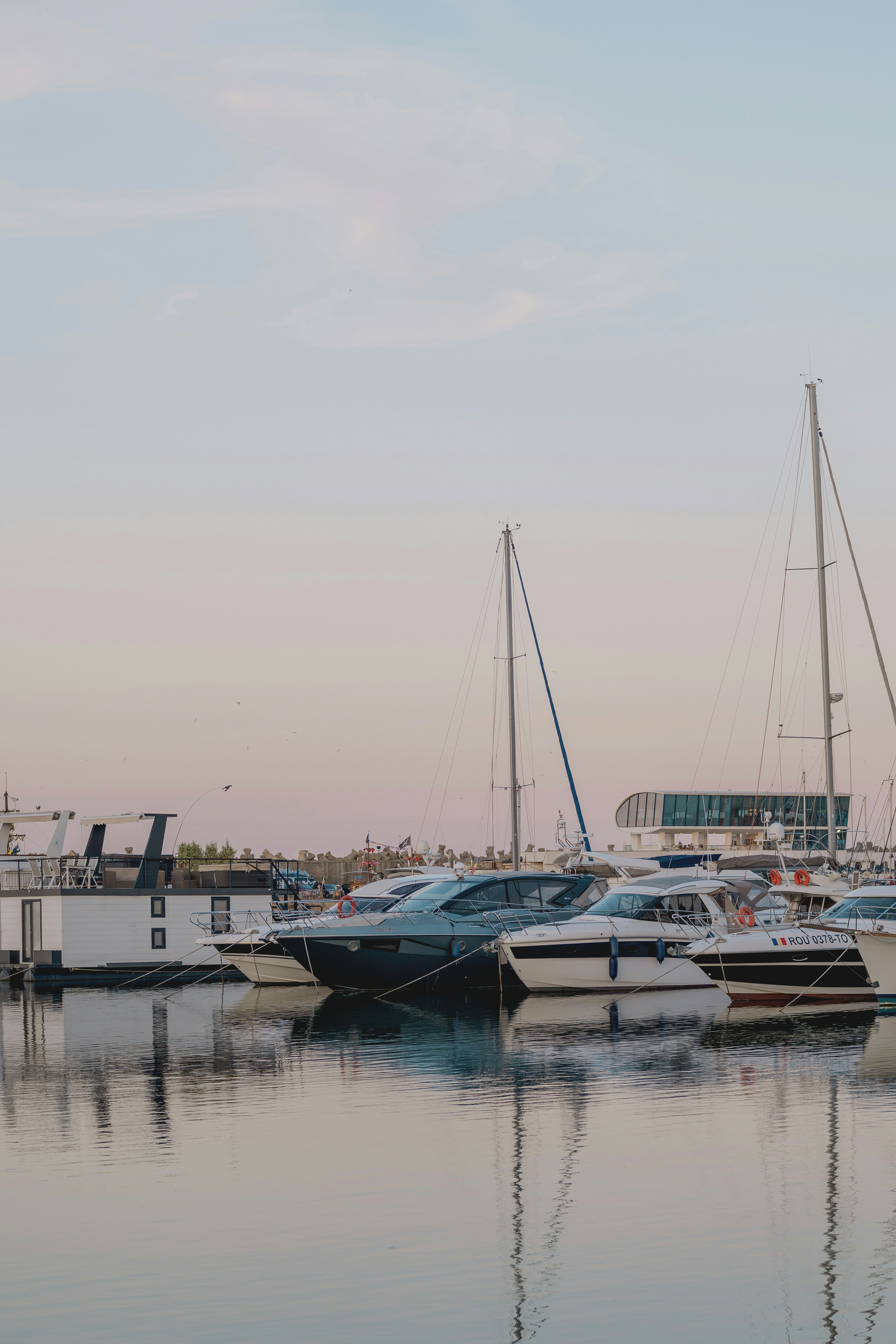 Calm Marina: Boats Resting on a Quiet Evening Pool