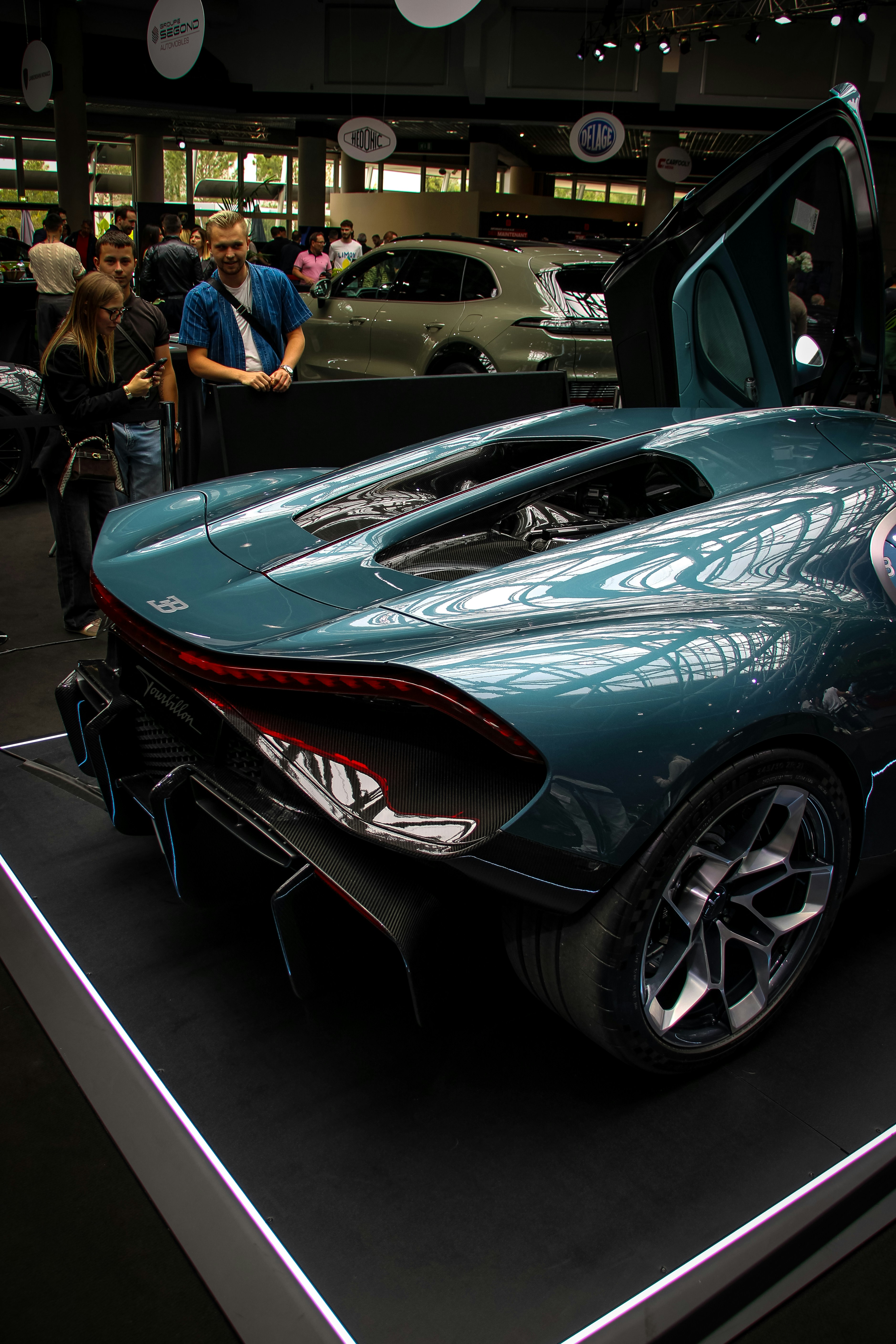Chrome Curves: The Blue-Gold Hypercar at a showroom unveiling