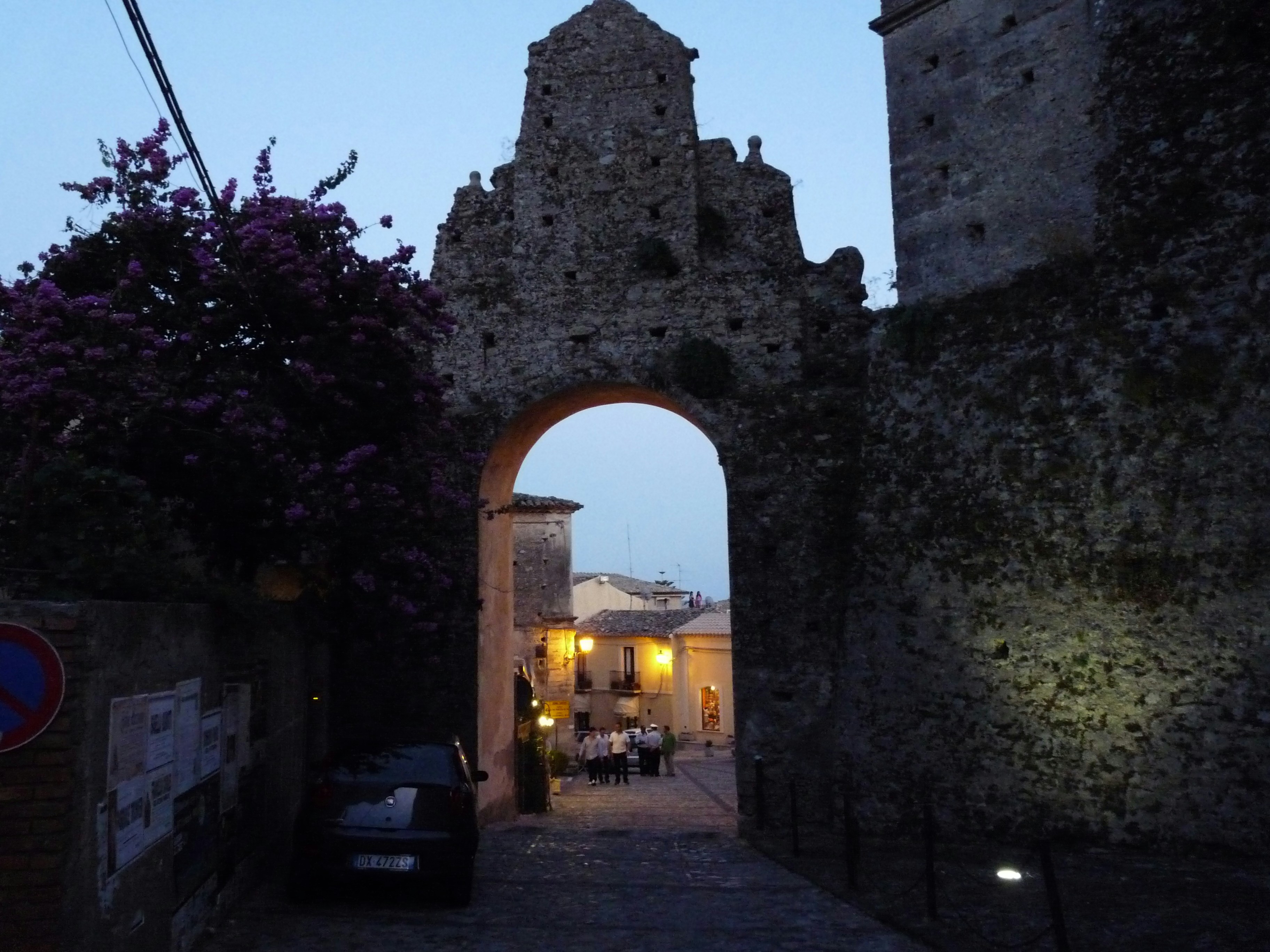 Arched Gateway to a Quiet Evening Piazza