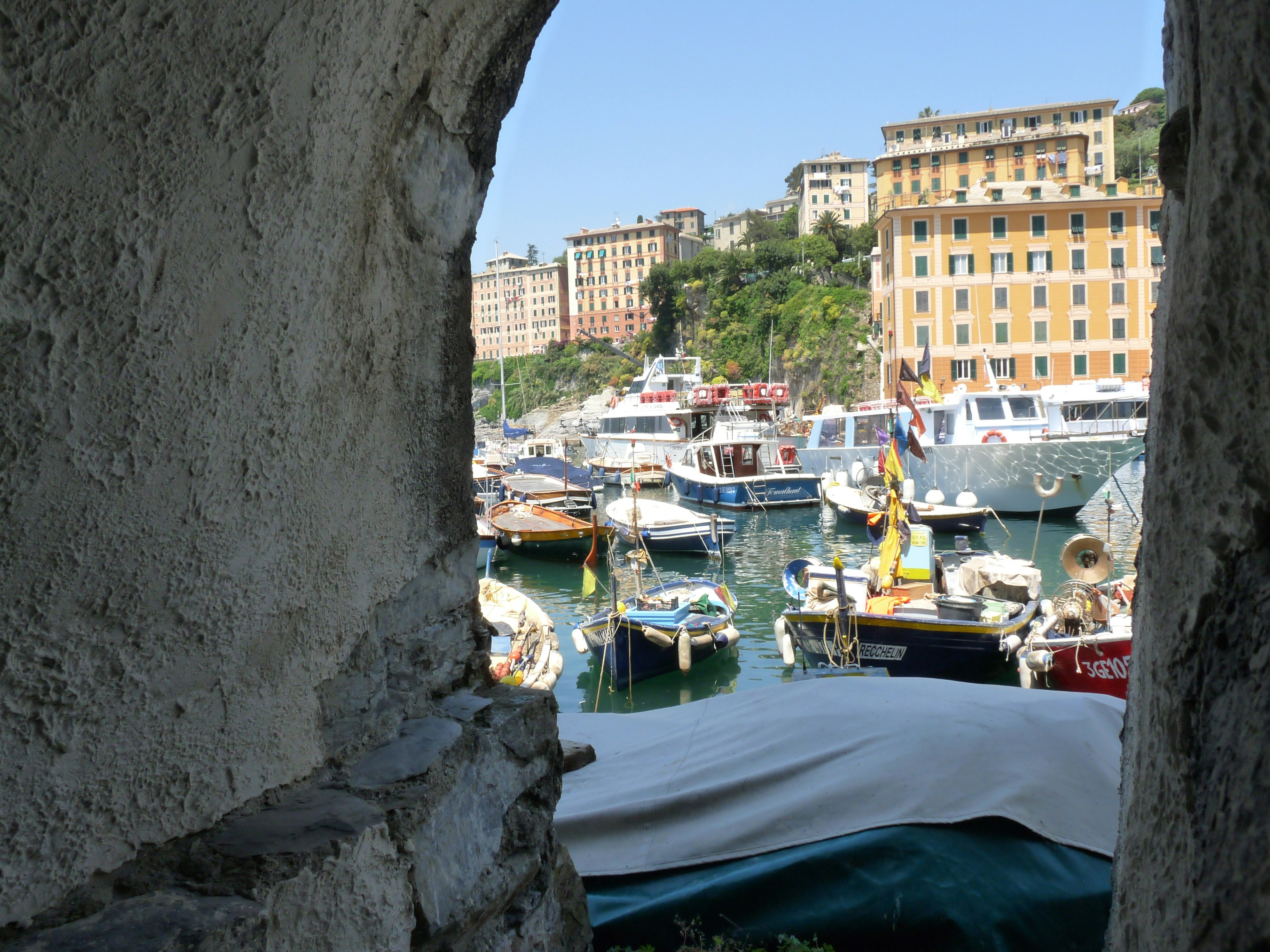 Harbor Gate: Boats Nestled Beyond a Stone Arch