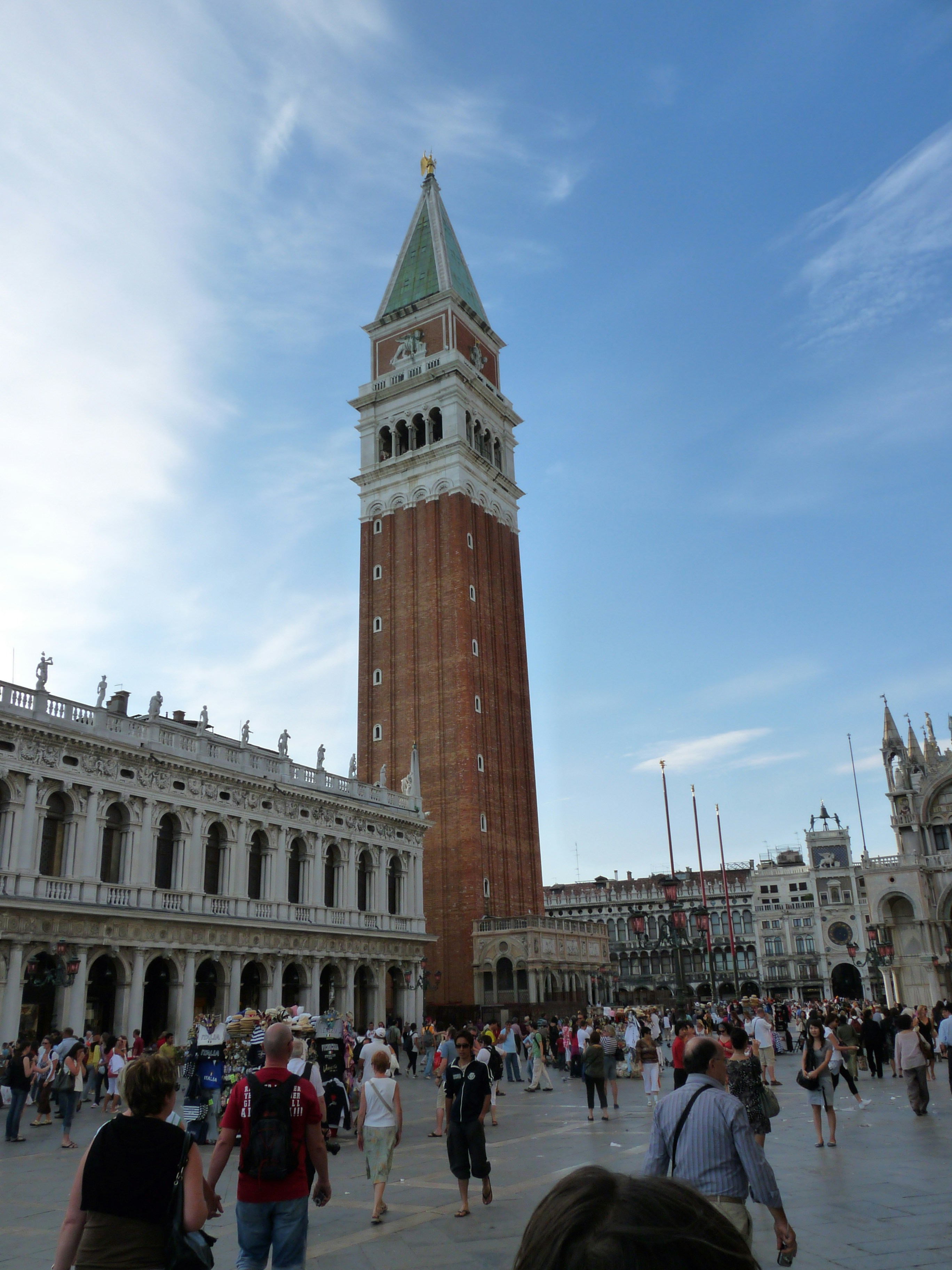 St. Mark's Square Dawn: Clocktower and Crowd under a Clear Sky
