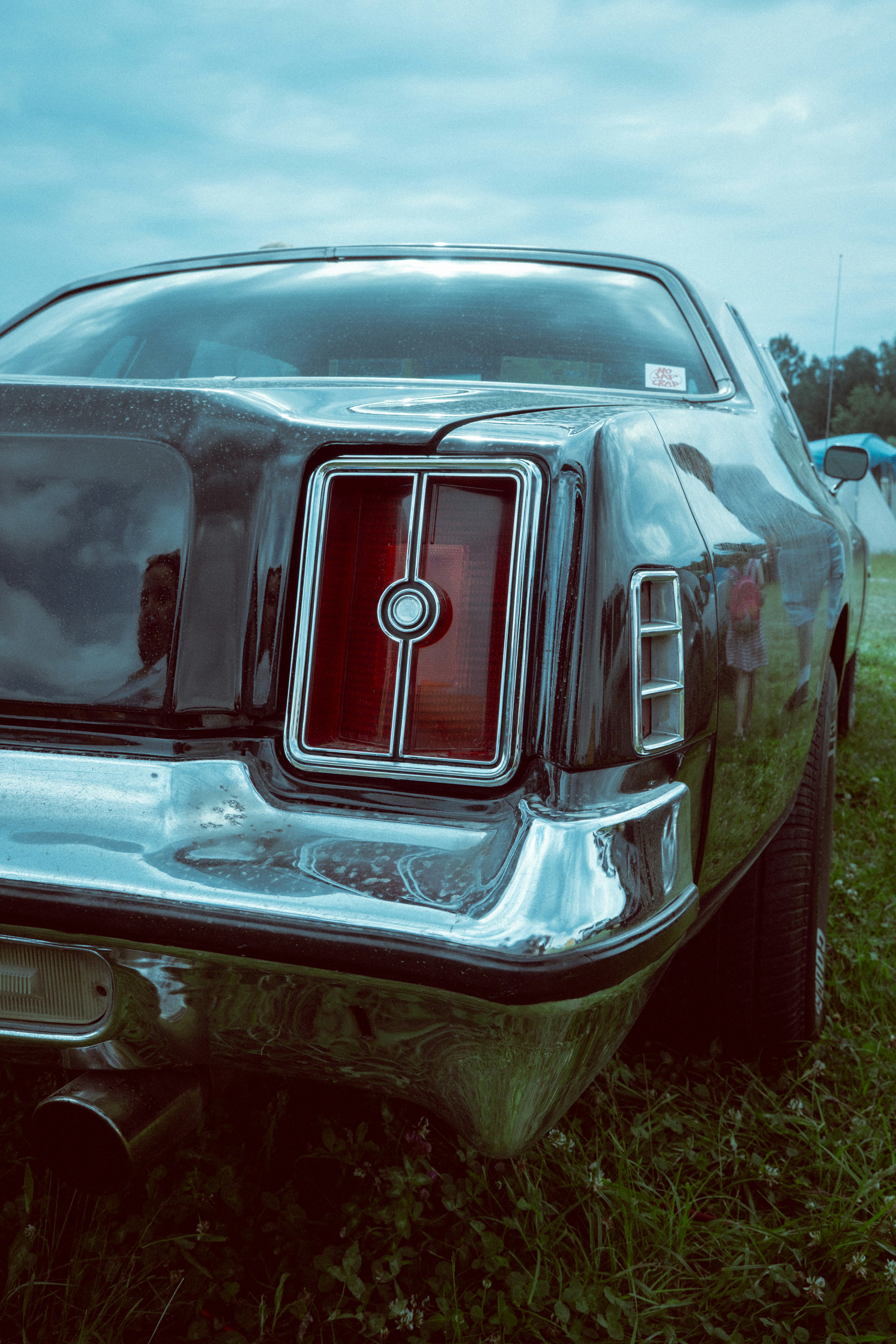 Chrome Reflection: The Tail of a Classic at Rest