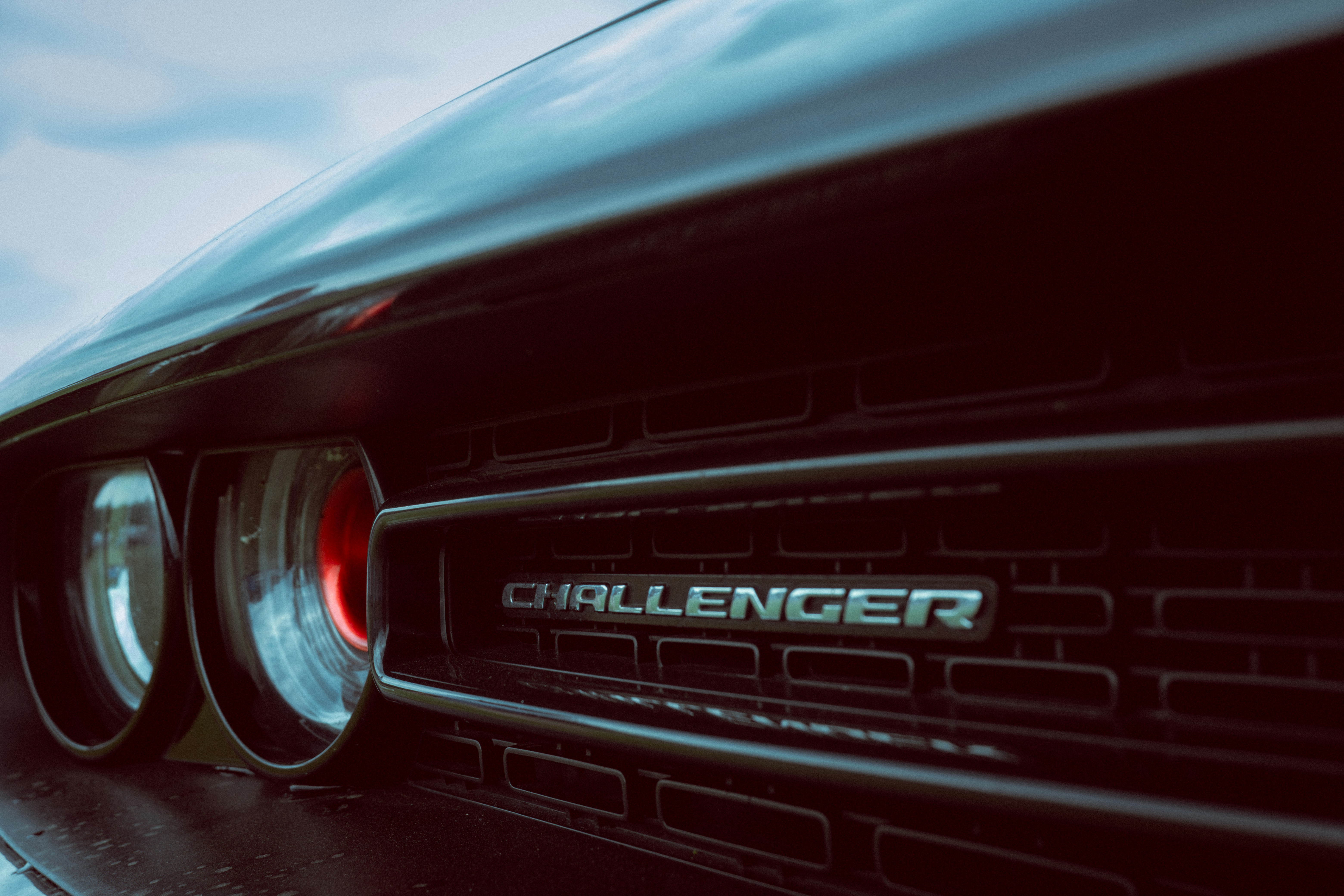 Challenger Emblem in Focus: A Low-Angle Close-Up of a Classic Front