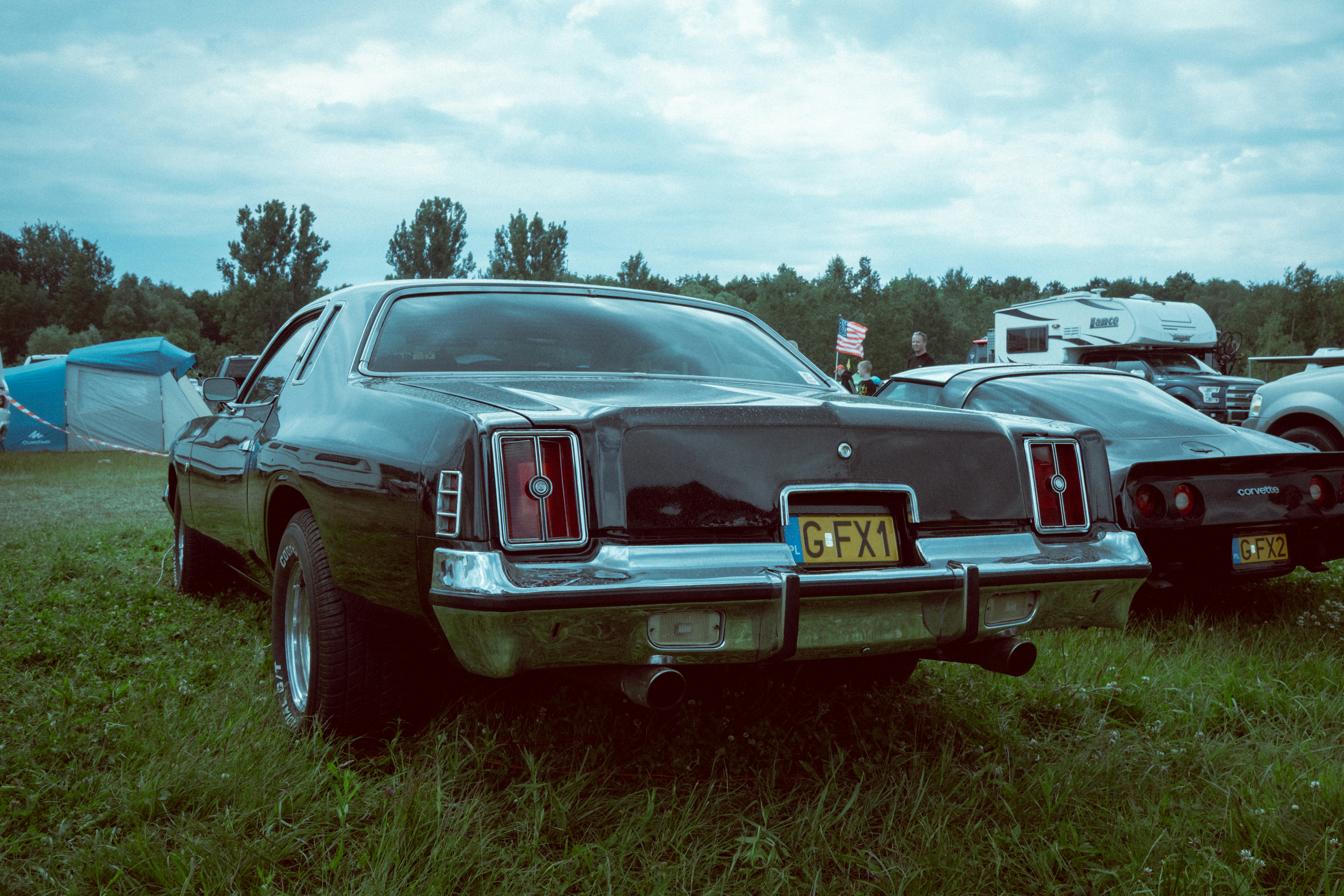 Tail Lights and Chrome: A Classic Car Rest at Dusk