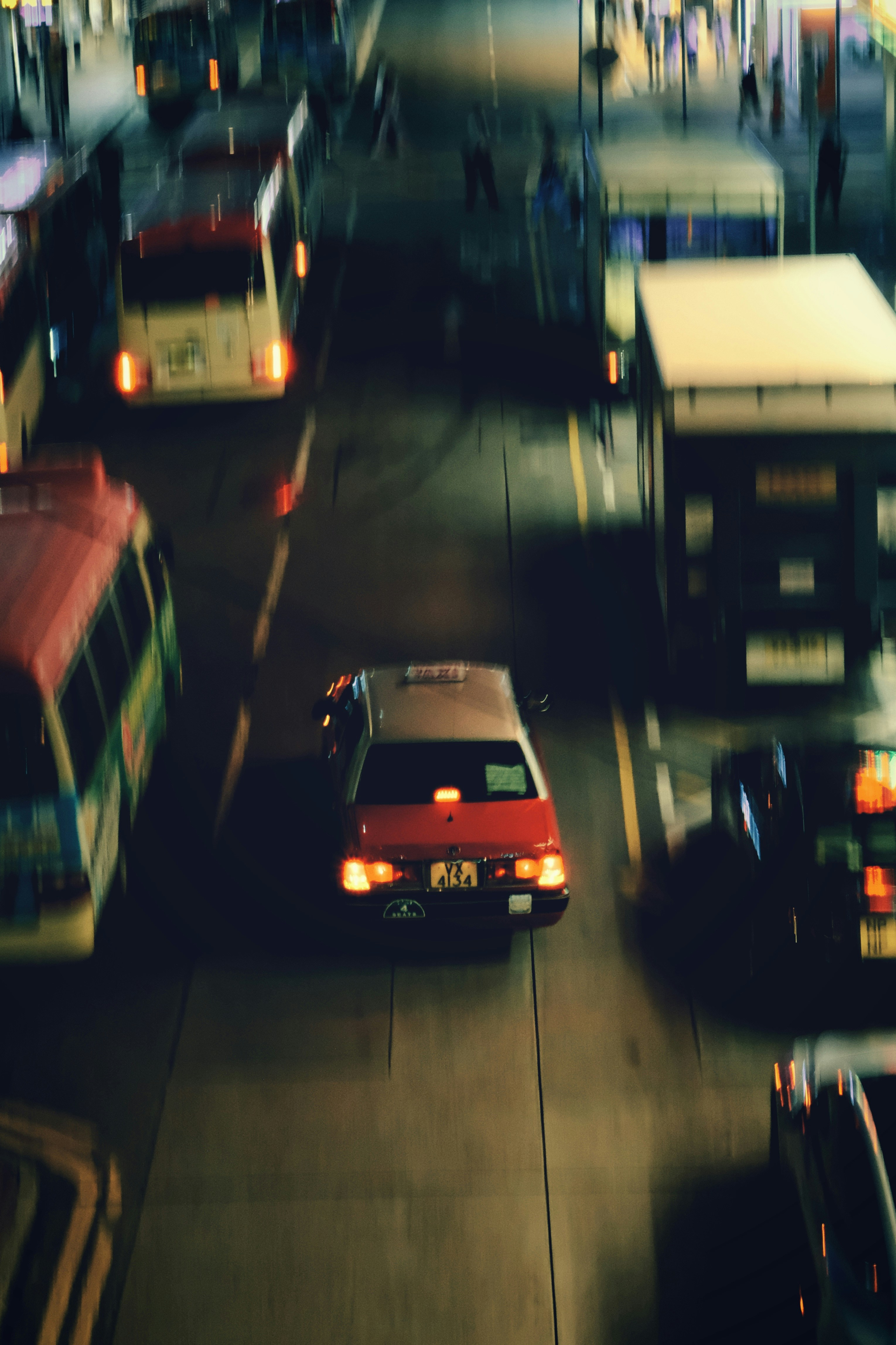 Midnight Metro: A Red Cab Leads the Quiet Neon Stream