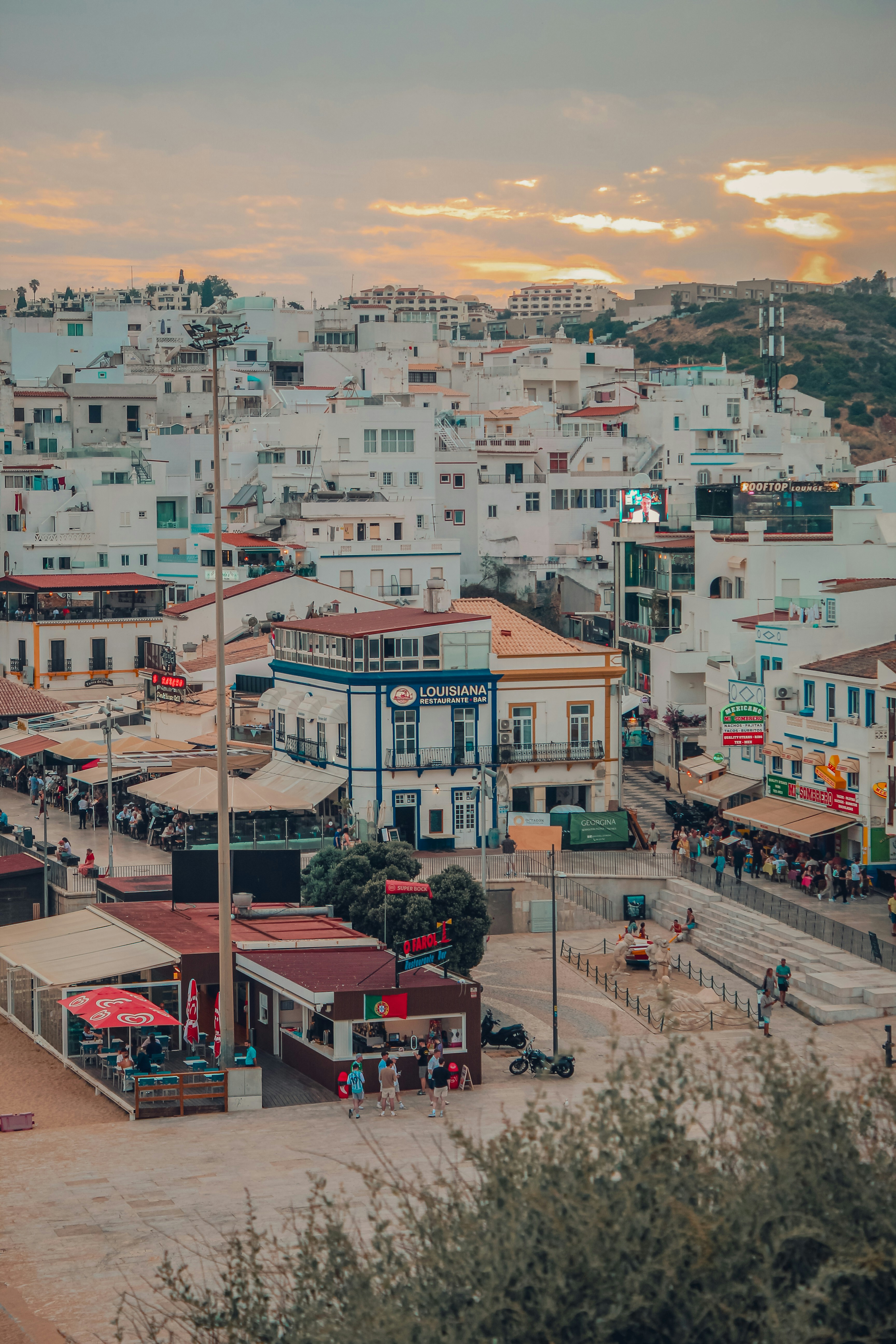 Sunset over the hillside town: a maze of white-walled streets and terracotta roofs