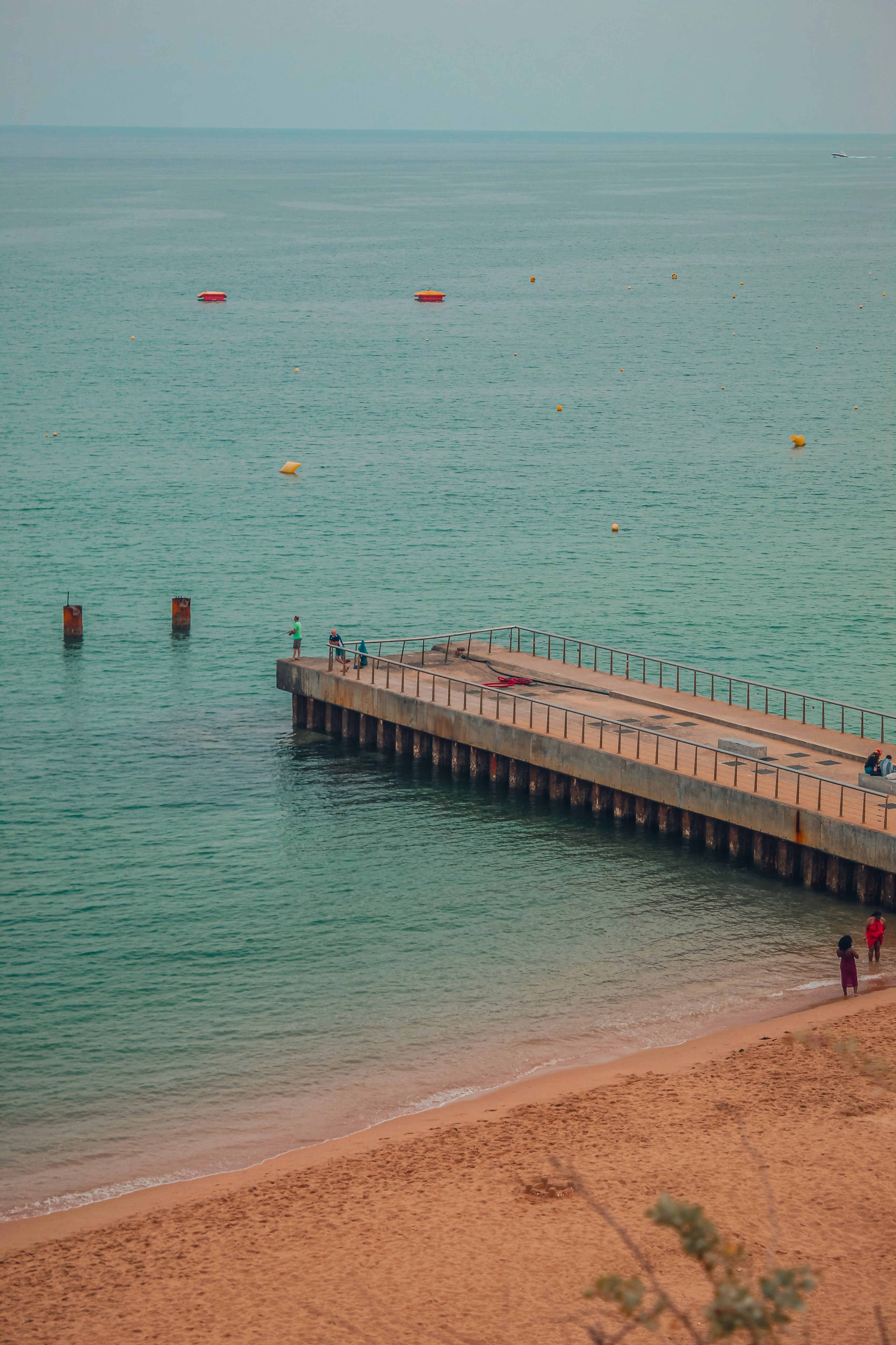 Pier Reaches into Turquoise Calm