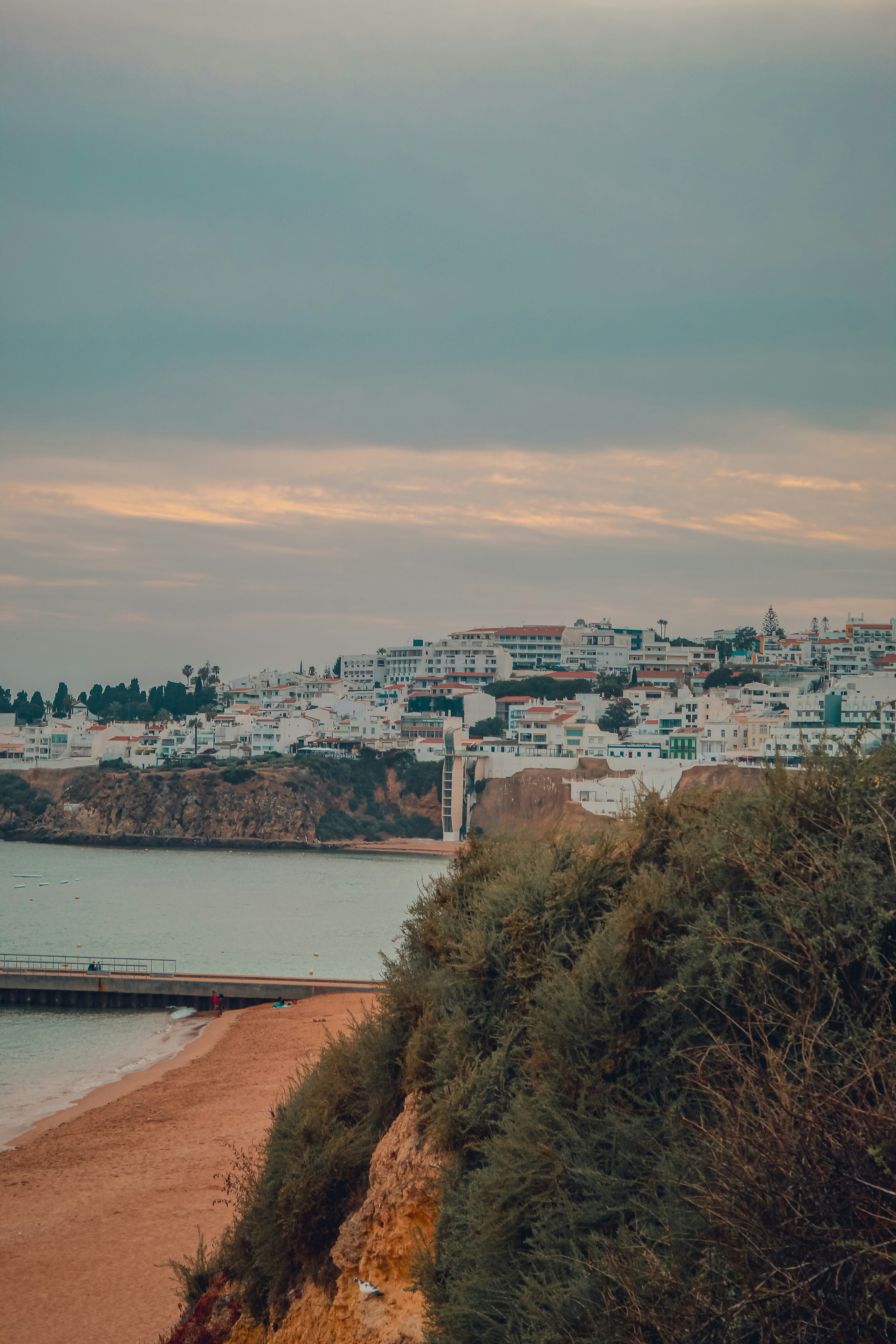 Cliffside Townscape Overlooking a Quiet Sea at Dusk
