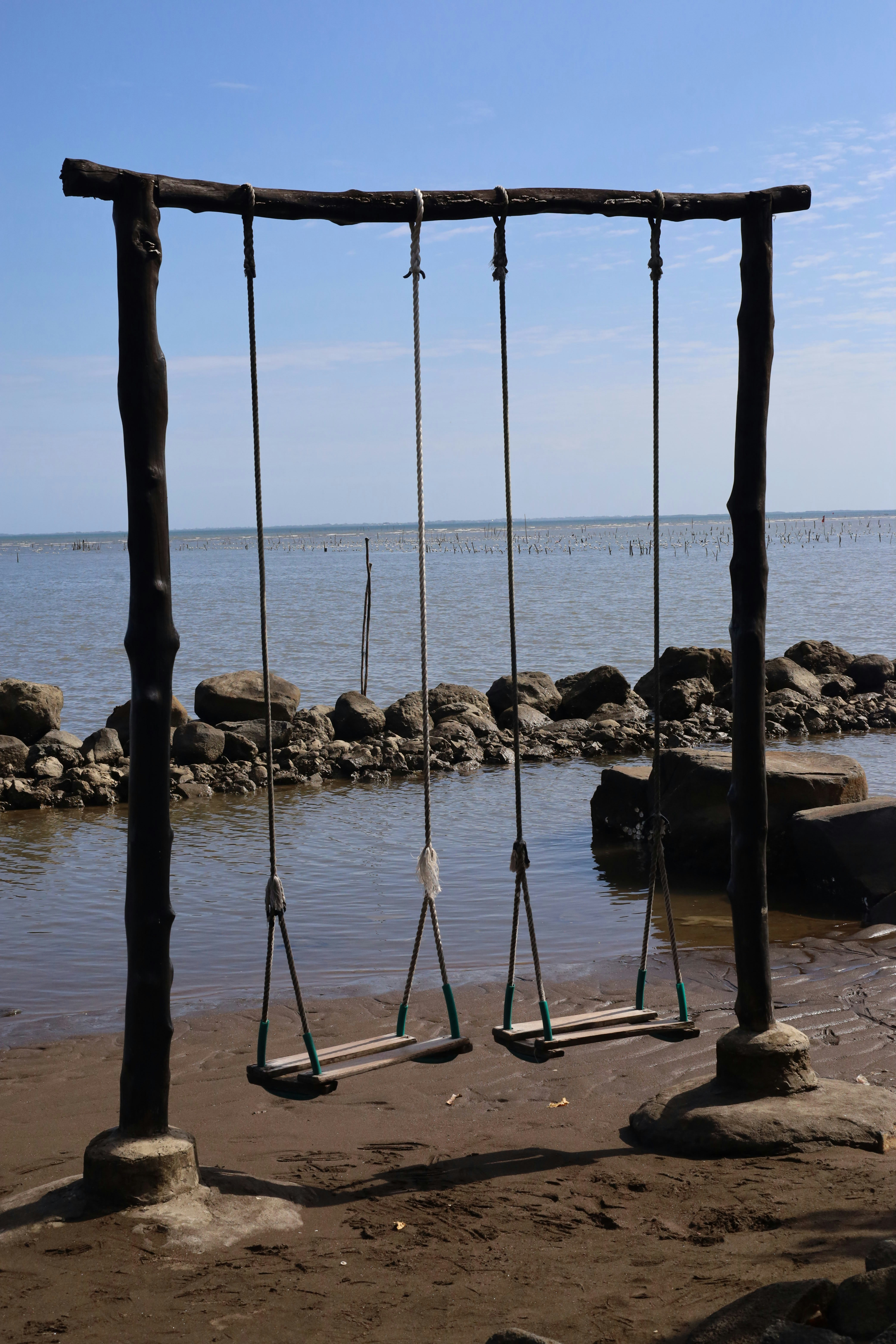 Seaside Swingframe at the Edge of Calm Waters