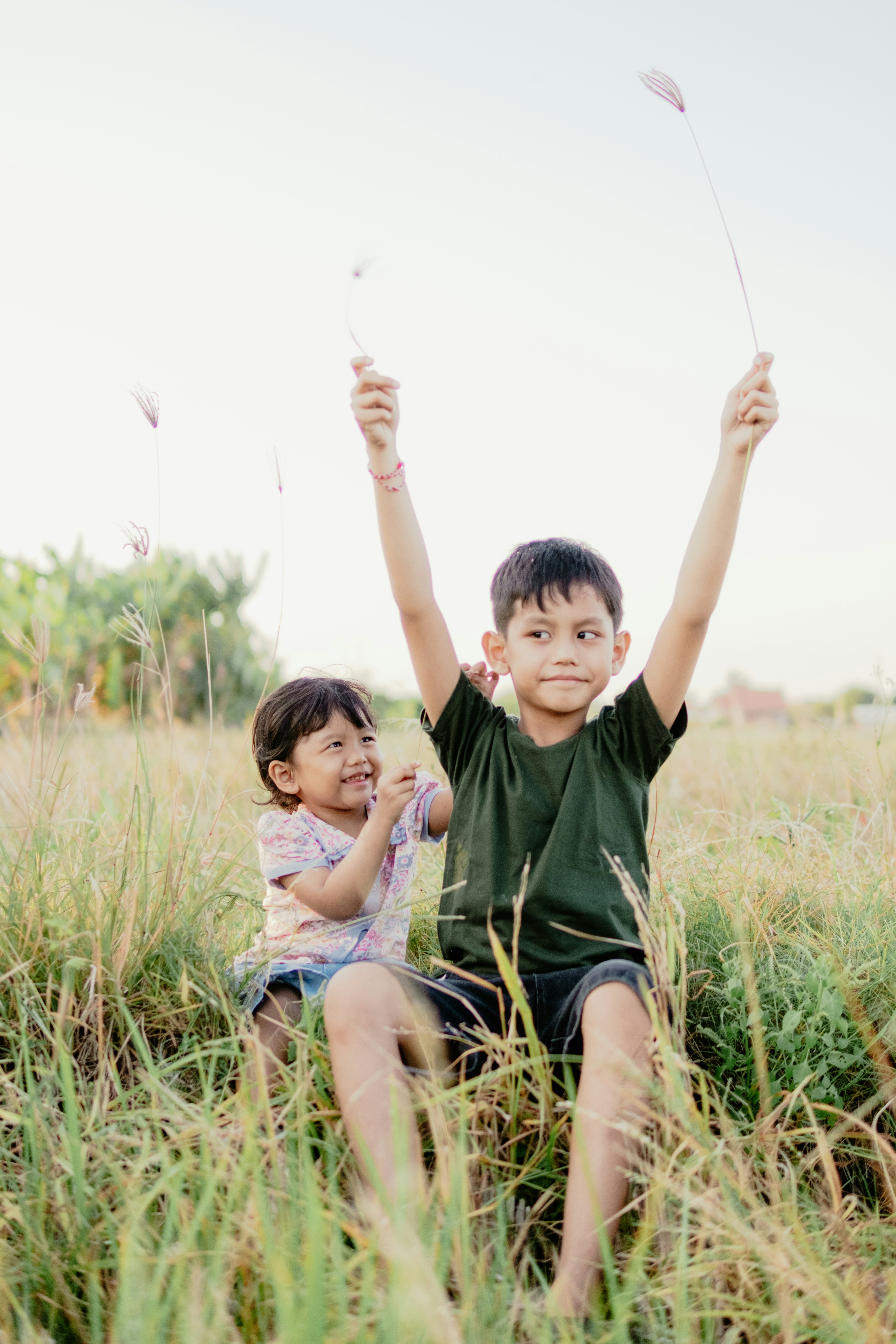 Joyful Highlanders: A Brother Lifts the Day with a Whisper of Grass