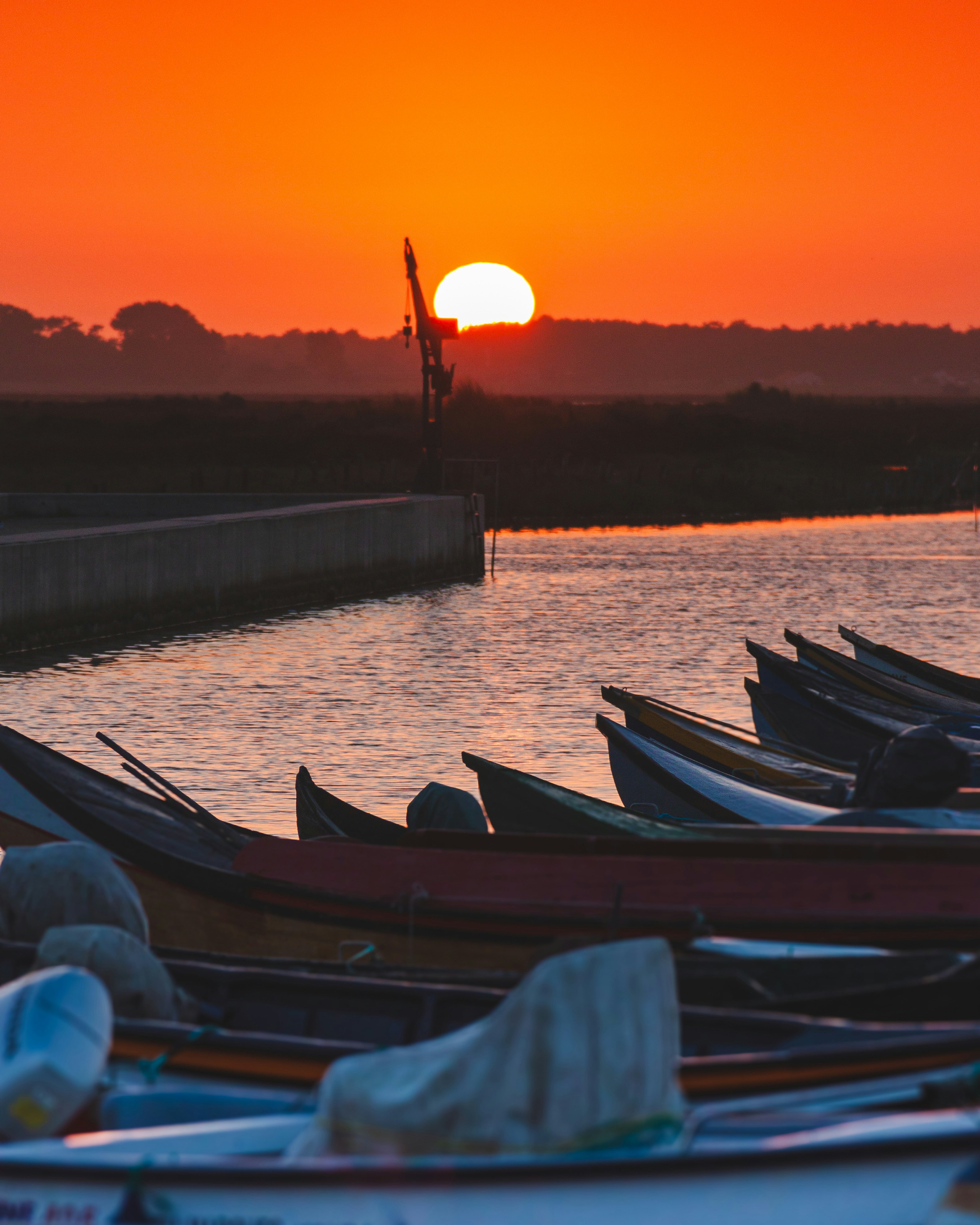 Sunset Dock: Boats Rest Beneath an Ember Sky