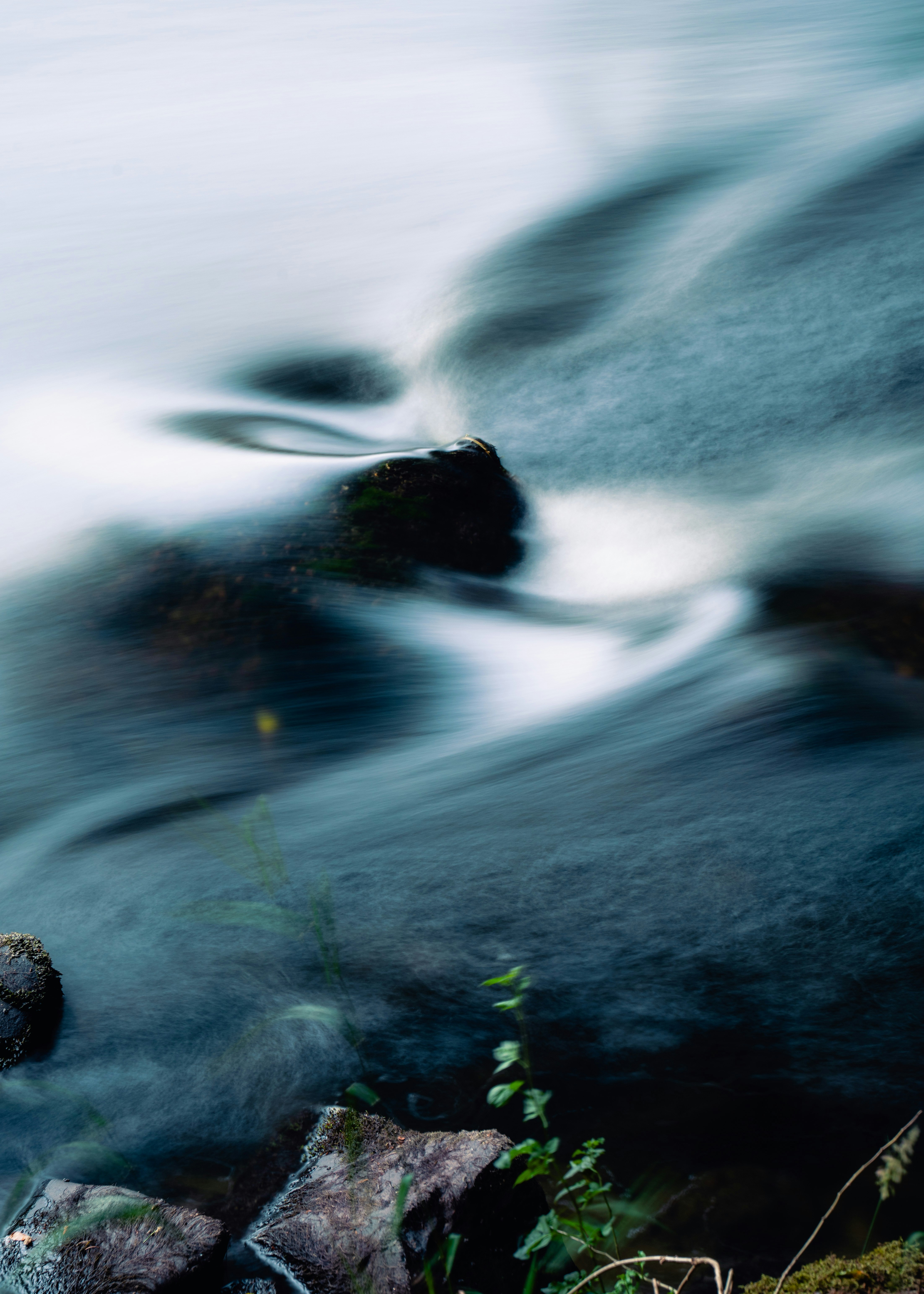 Whispering Currents over the Moss-Rimmed Stones