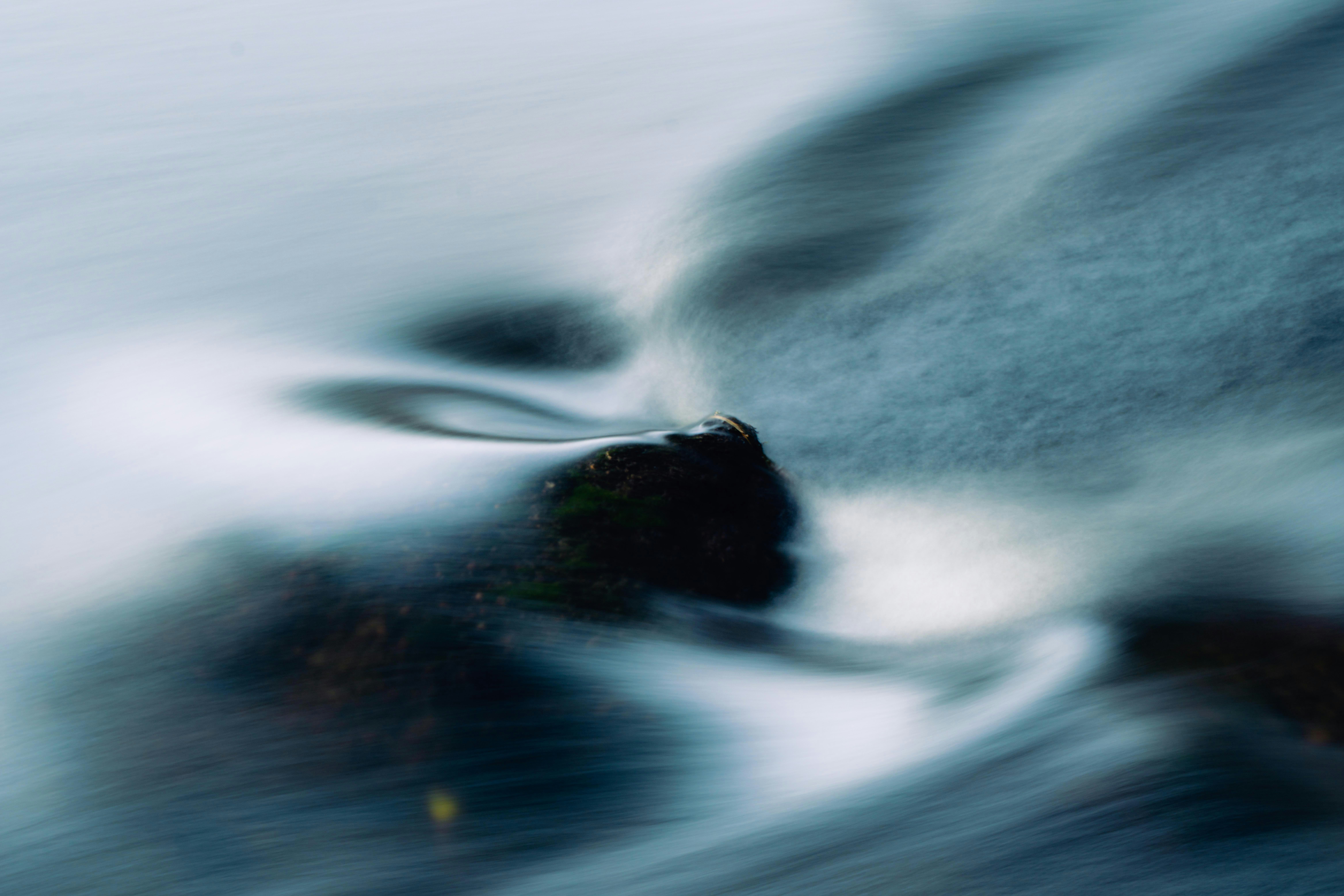 Whispering Stones Through a Looming Tide