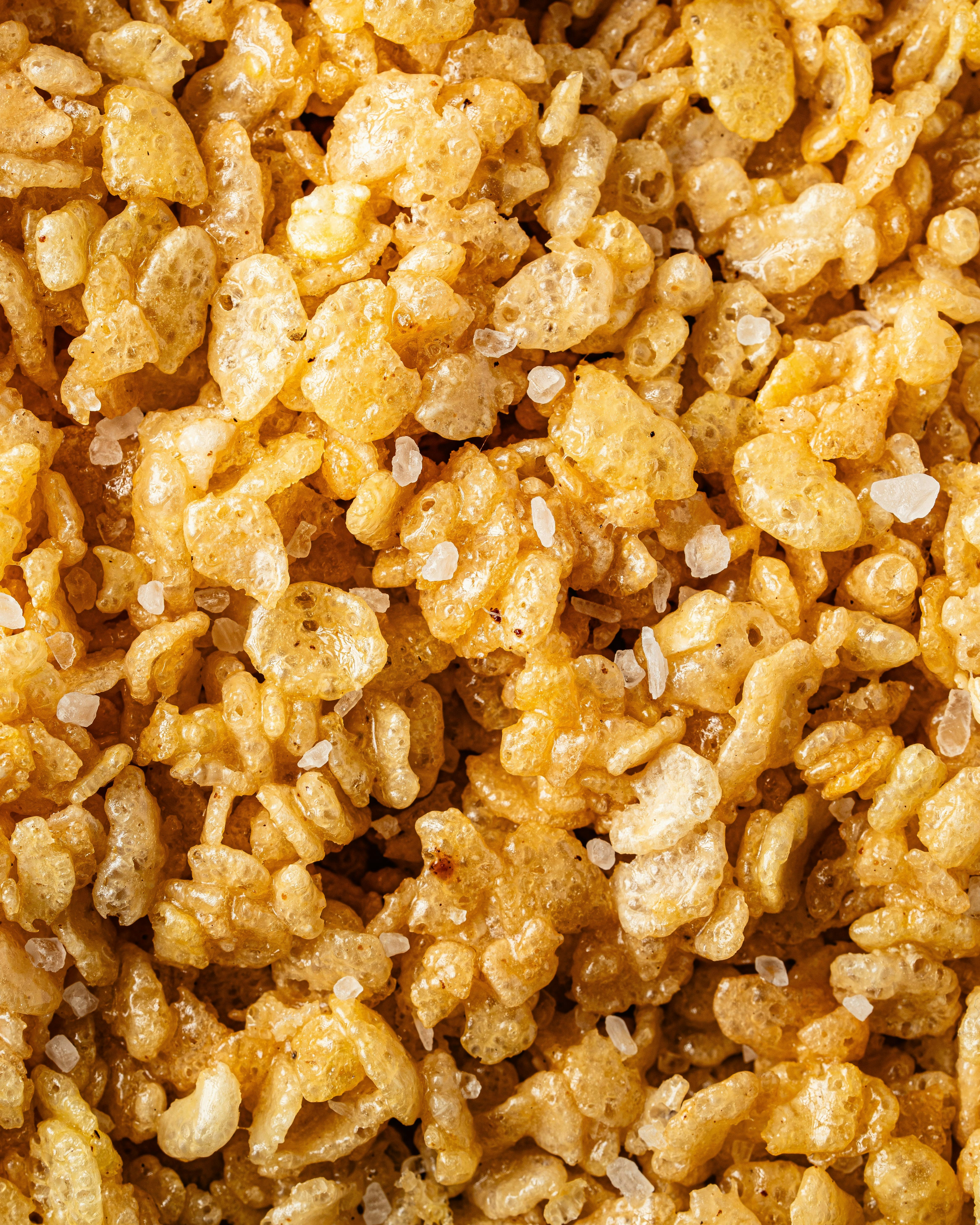 Golden Crunch: Macro Close-Up of Toasted Rice Pellets