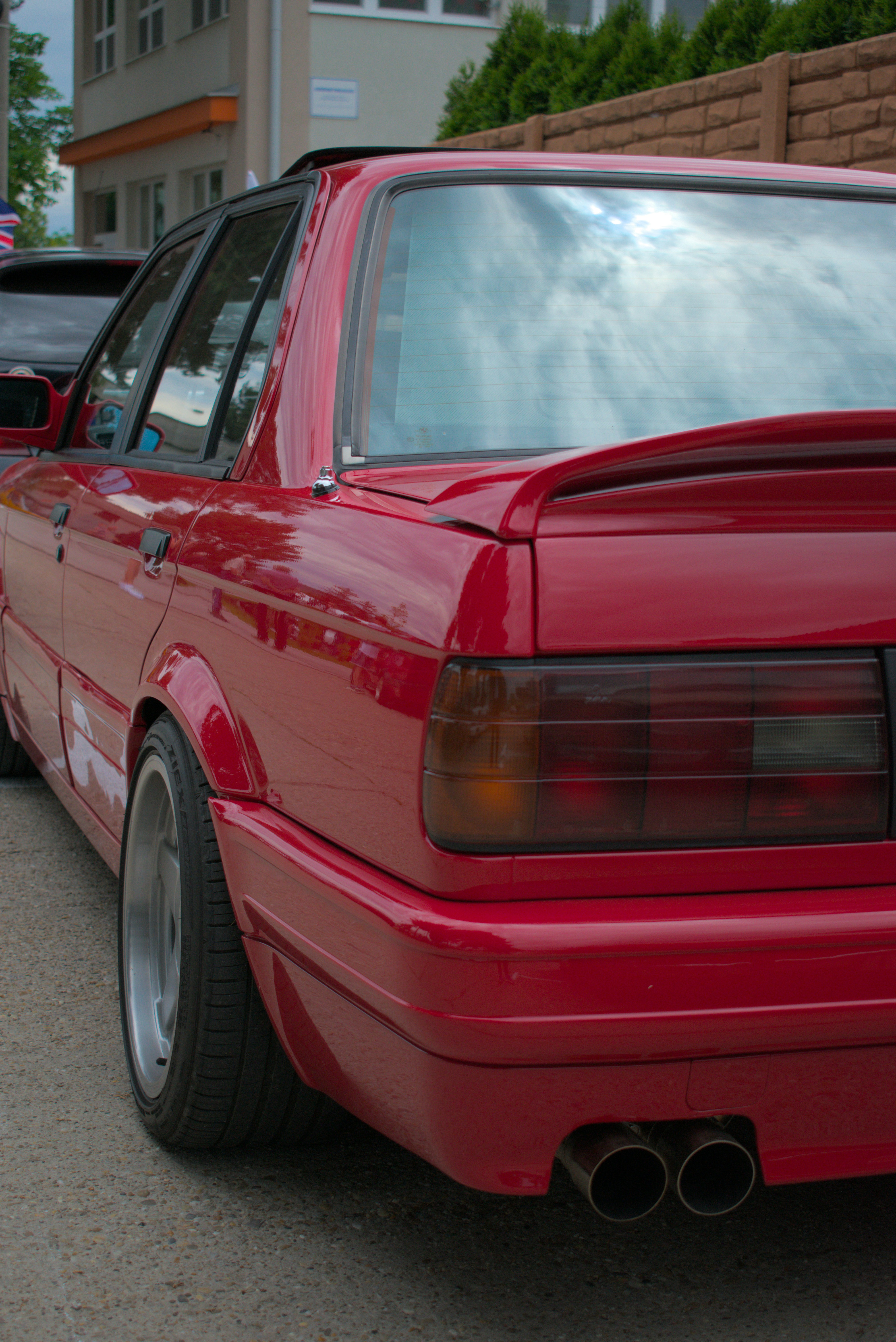 Red Muscle Car: Quiet Power at The Parking Lot Edge