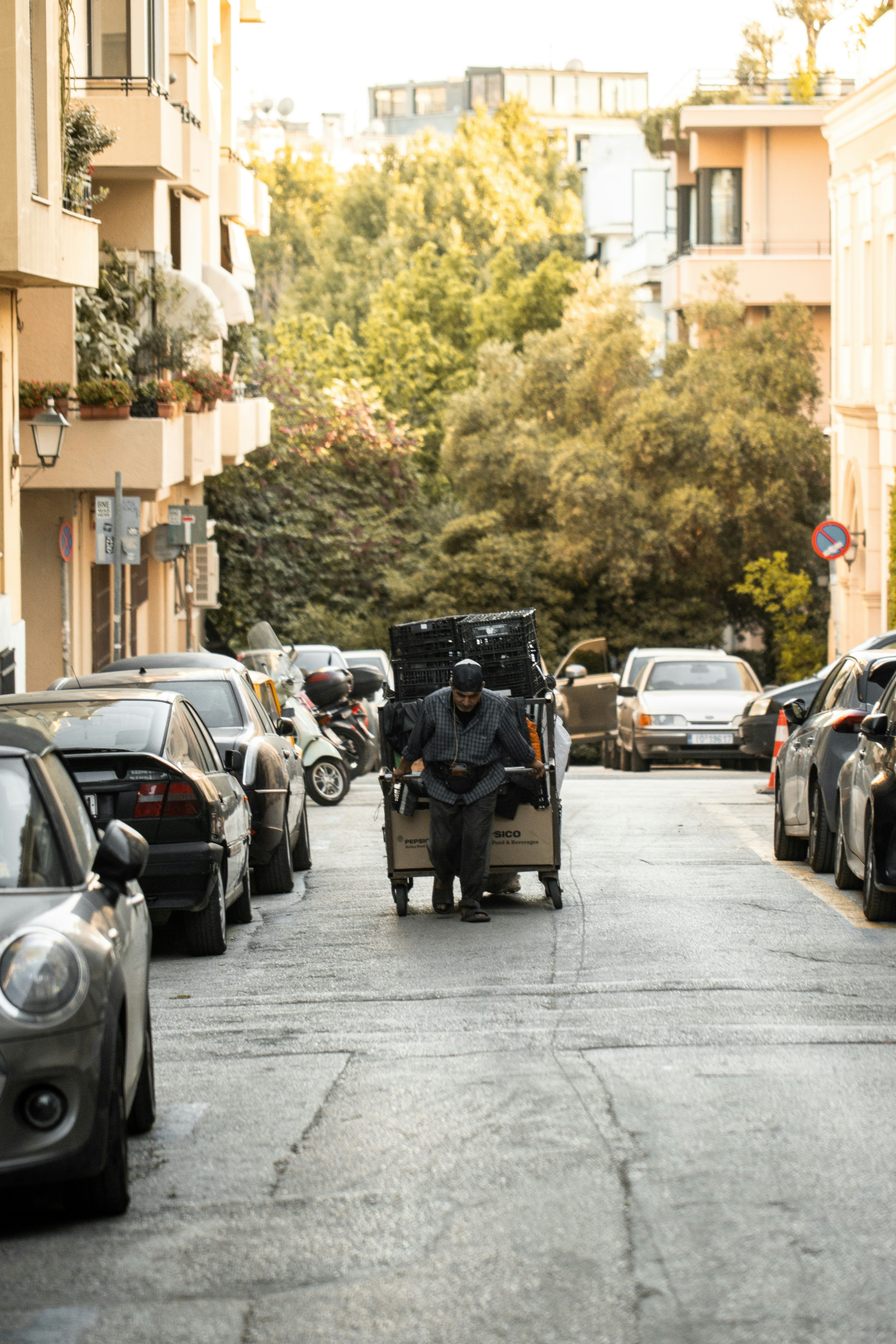 Cart on Wheels: Street Load Carrier Navigates a Quiet Urban Morning
