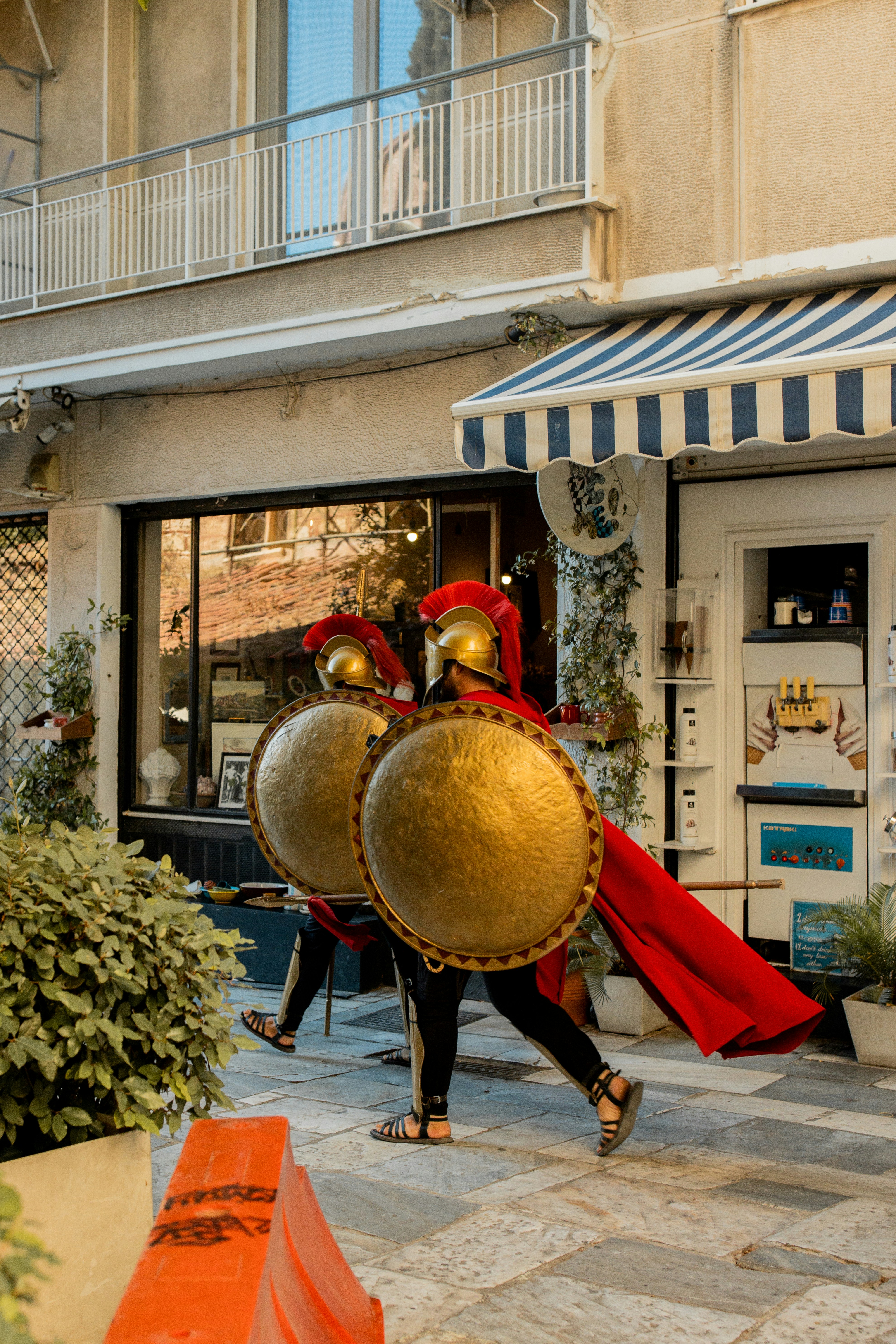 Red-Caped Shields in Step: A Street-Stride of Ancient Parade