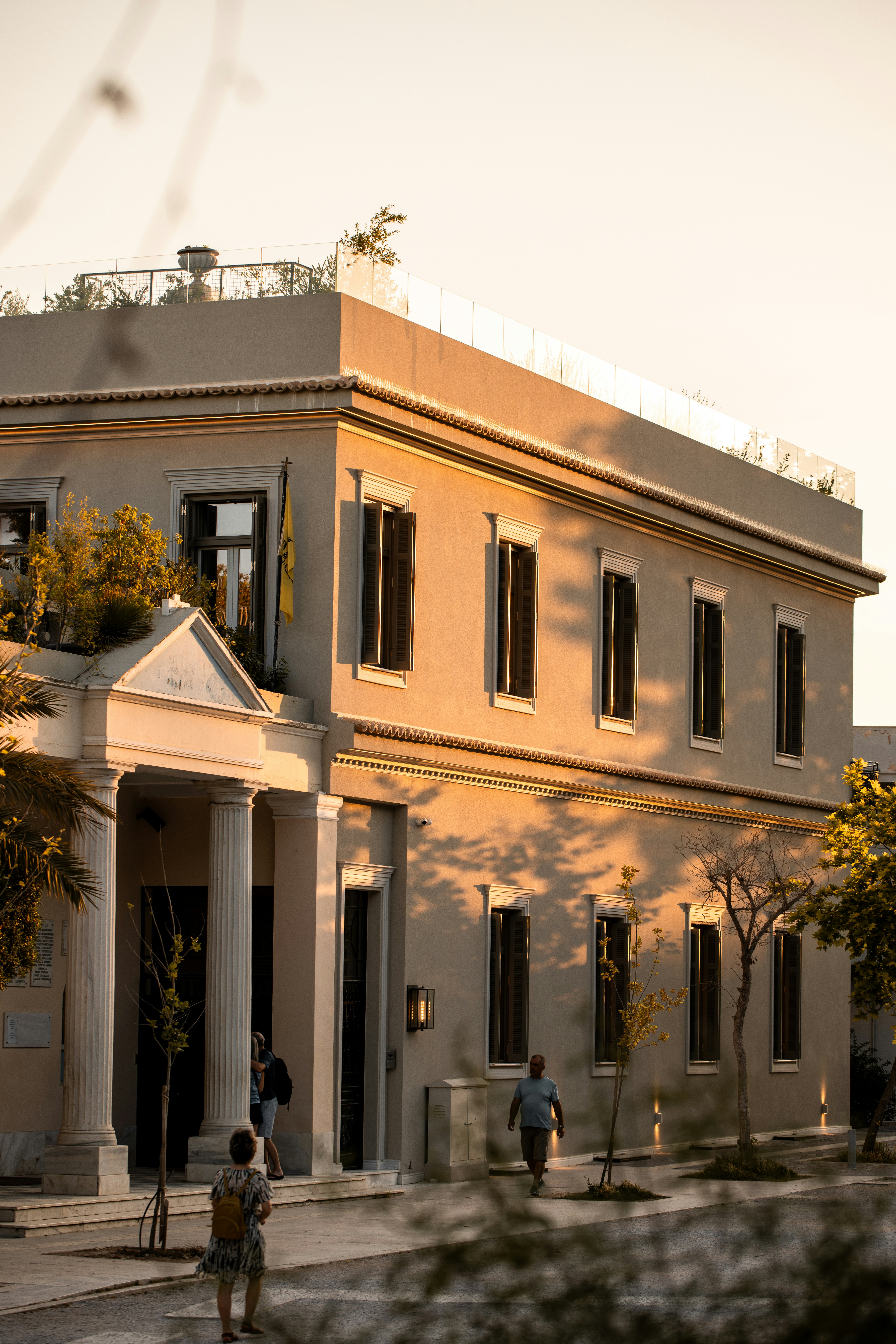 Warm Facade at Golden Hour: Classical Building on a Quiet Street