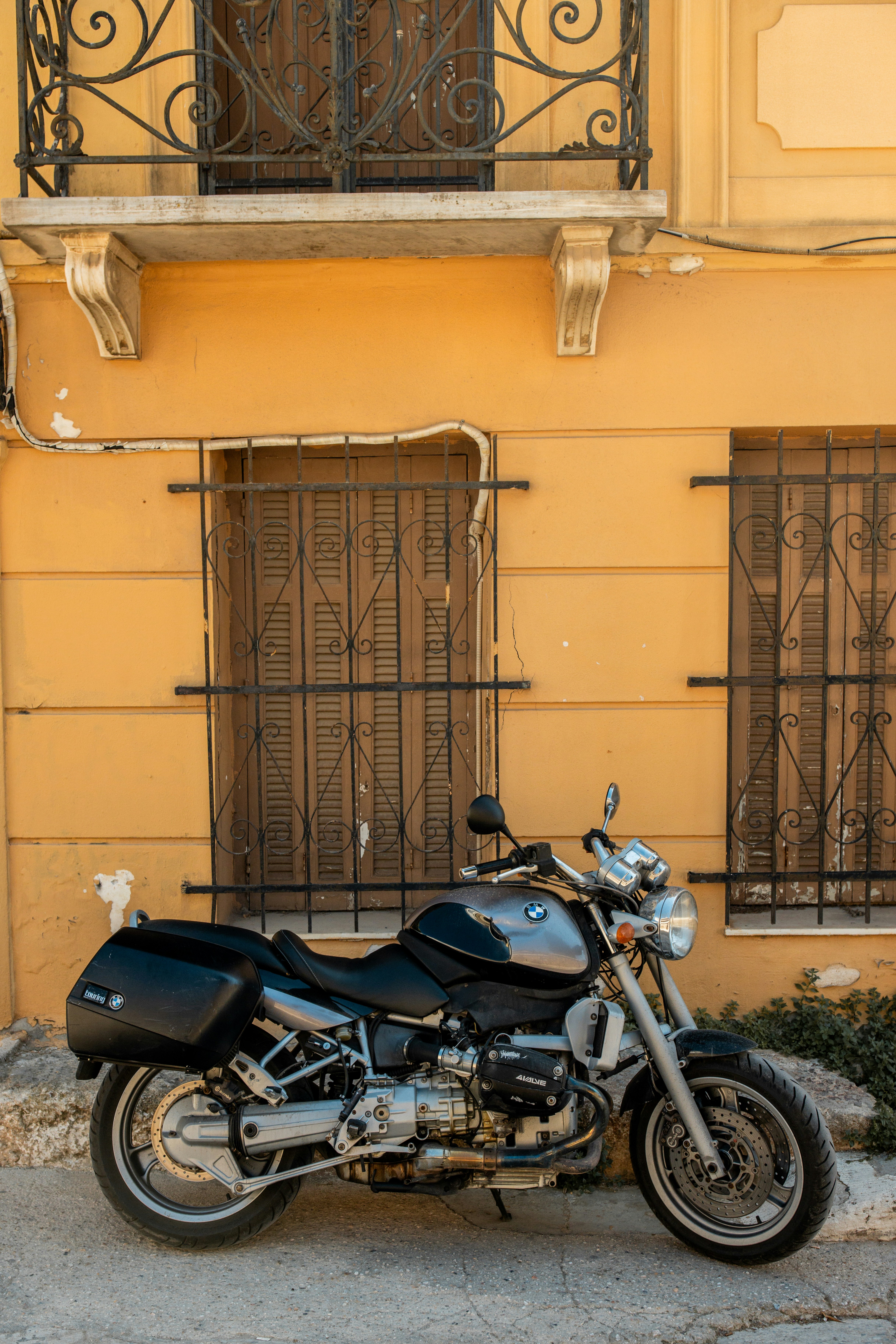 Yellow Facade and a Black Motorcycle: Street Level Portrait of Urban Quiet