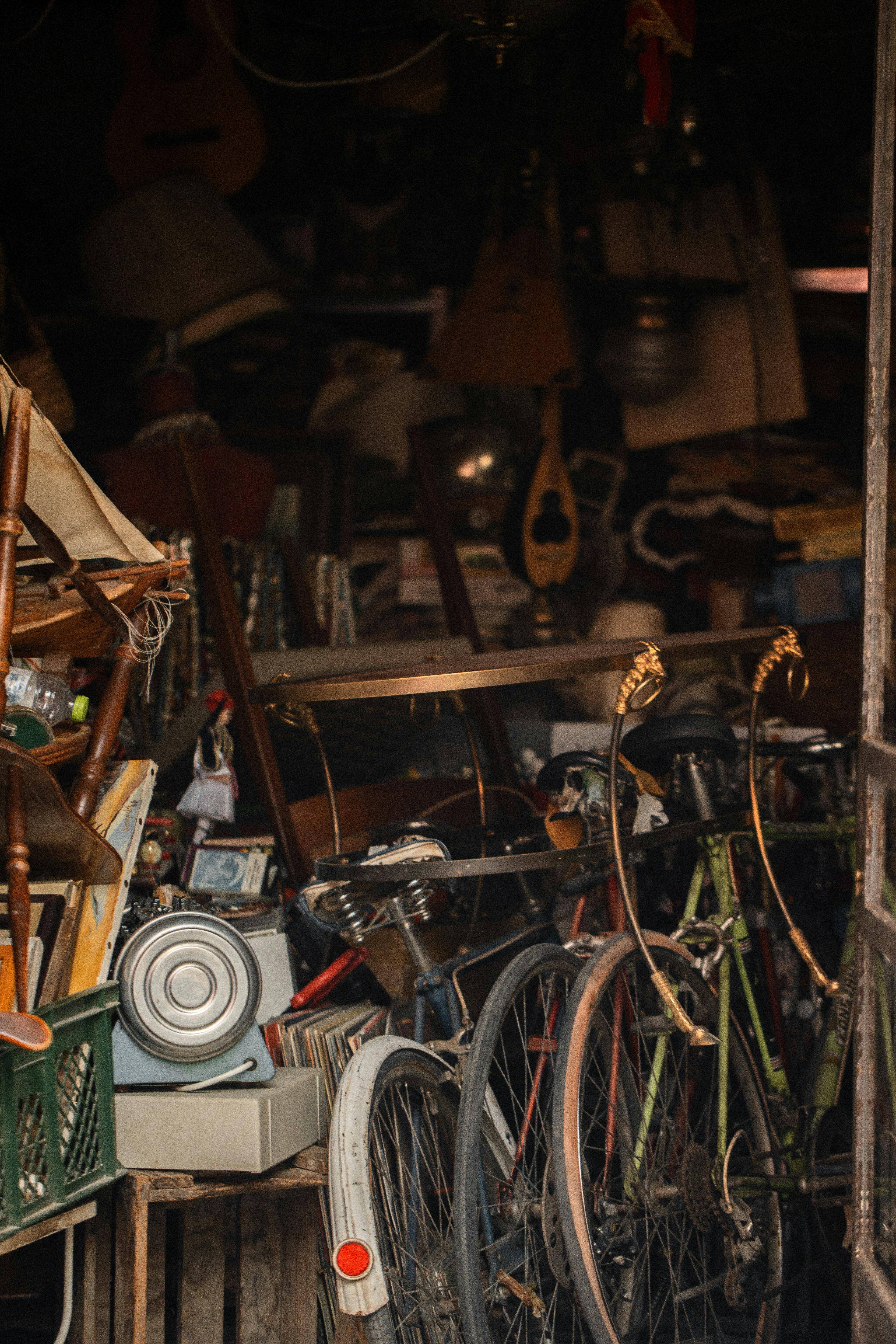 Low-Light Junkyard Choir: A Bicycle Shop Nestled in Shadows