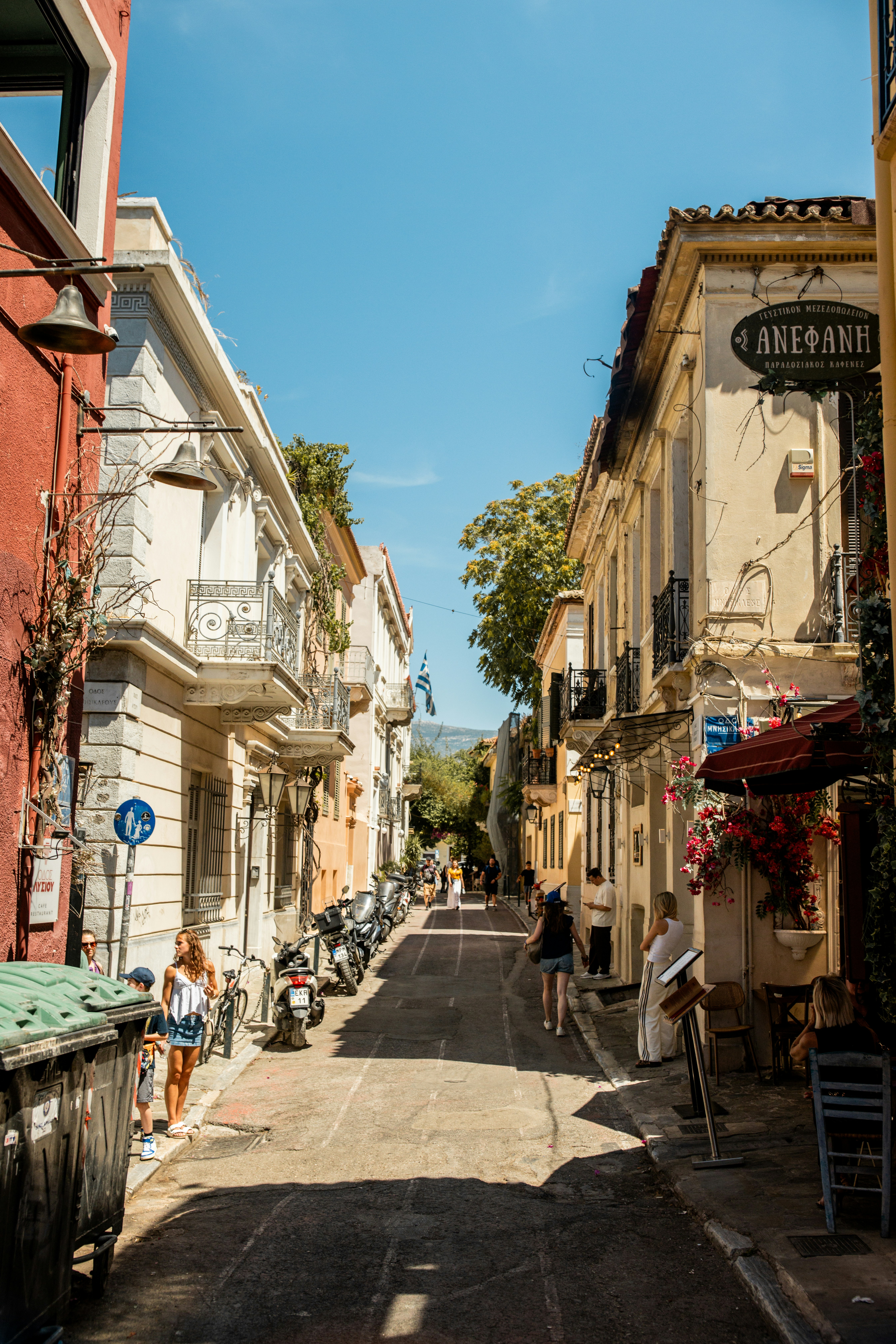 Sunlit Alleyway: A Mediterranean Street Scene in Vivid Noon