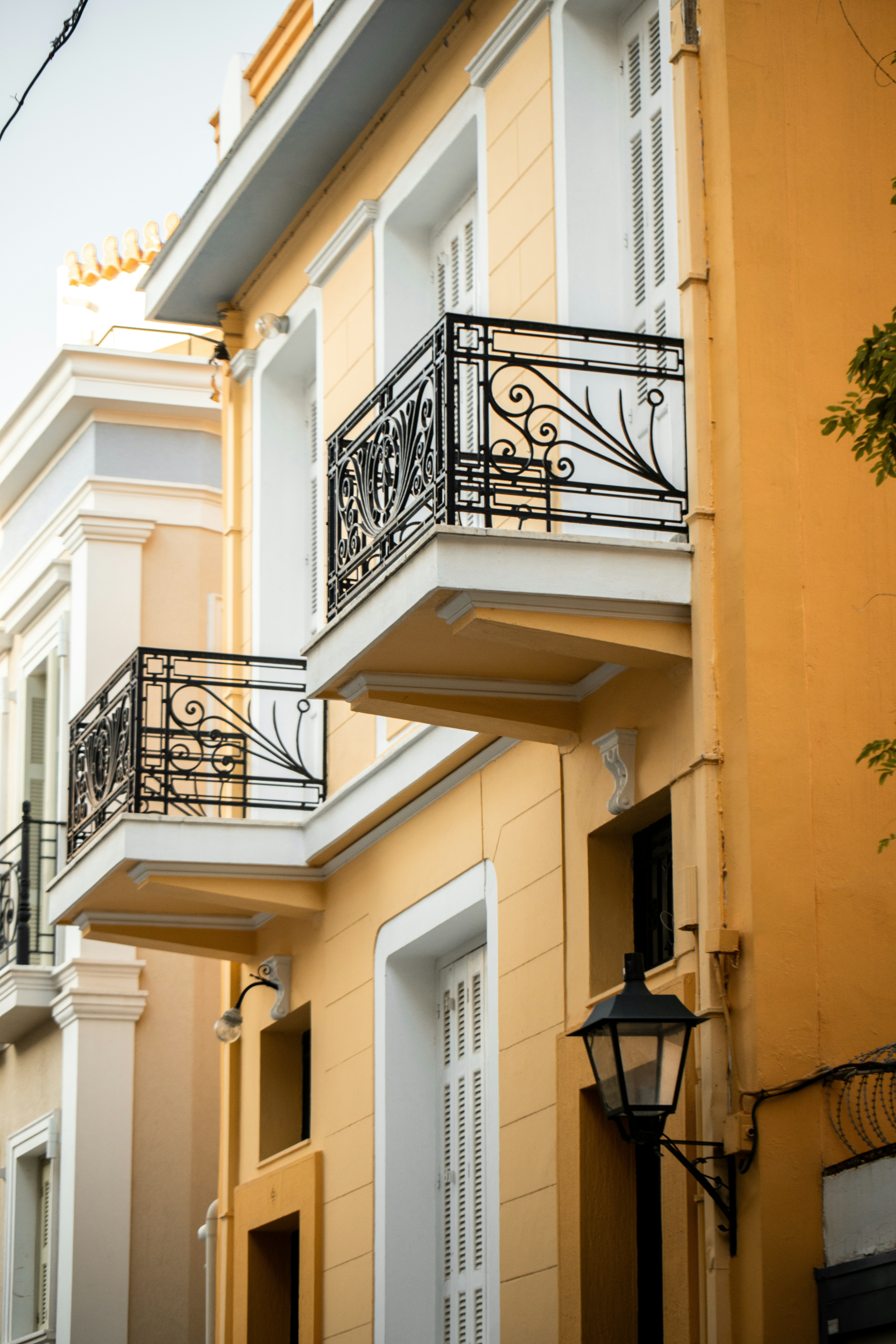 Sunny Facades and Wrought-Iron Balconies in a Coastal Town