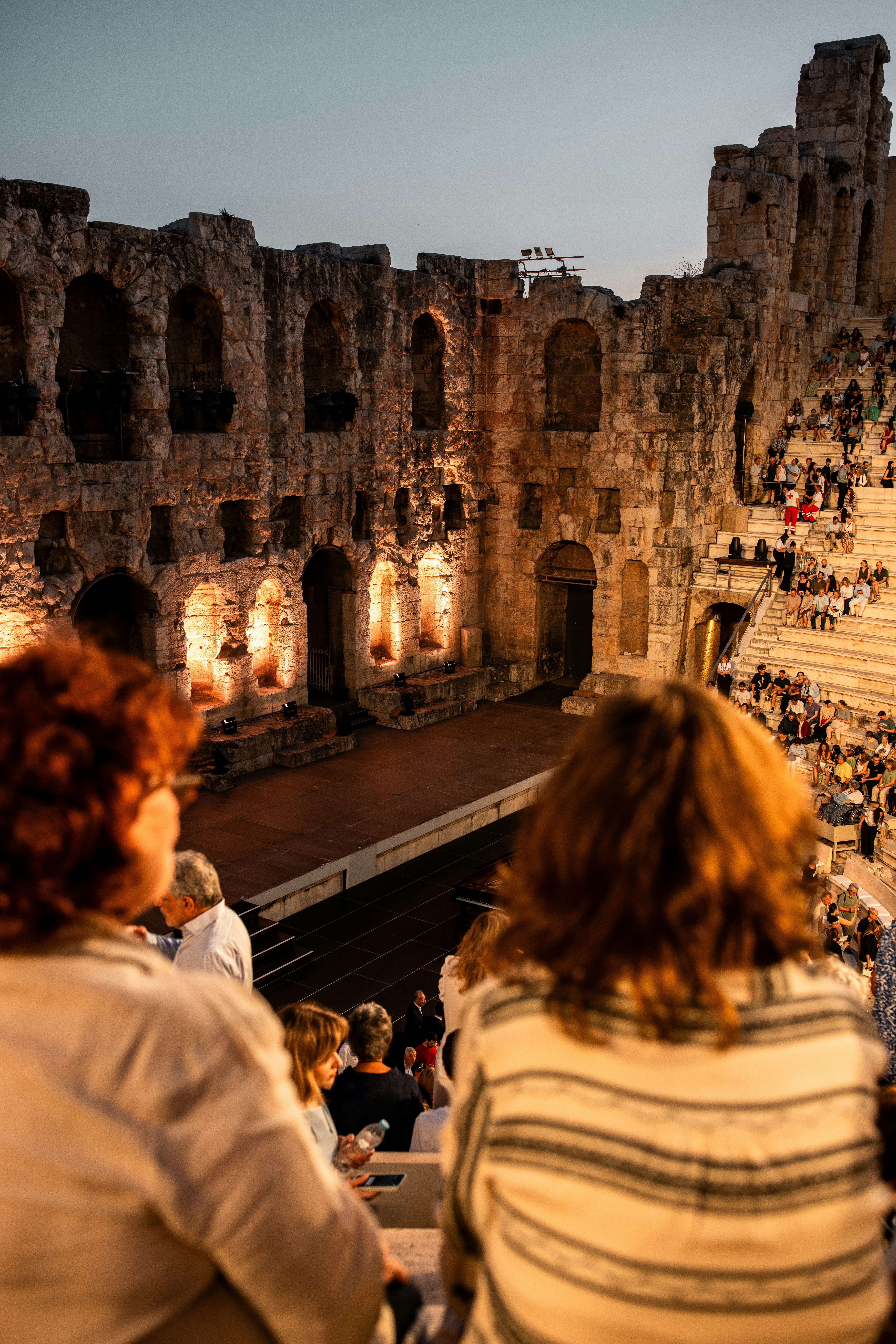 Crowd in Amanus Arena: Evening Light Over Ancient Stone Tiers