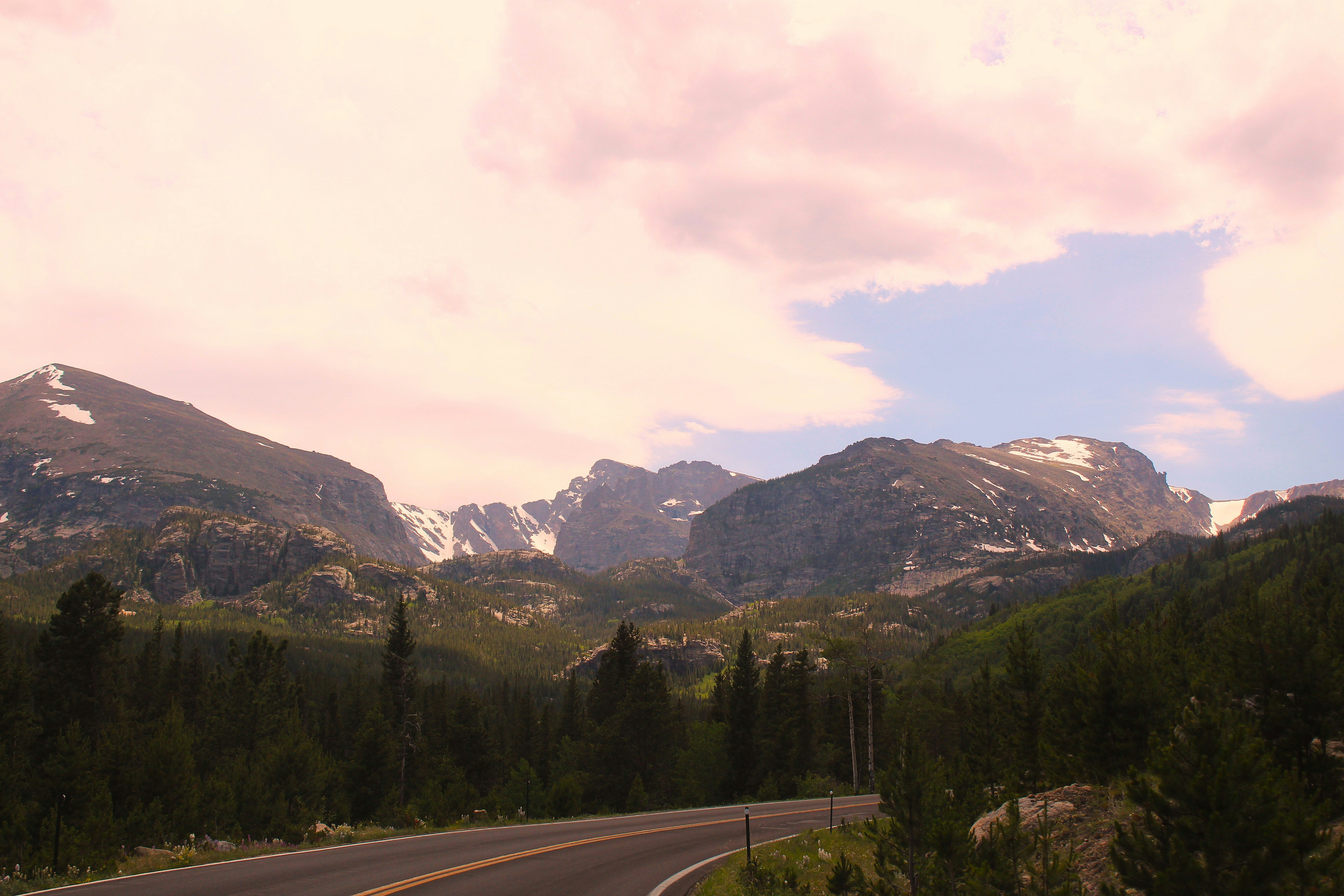 Snow-kissed Peaks Above the Winding Alpine Road