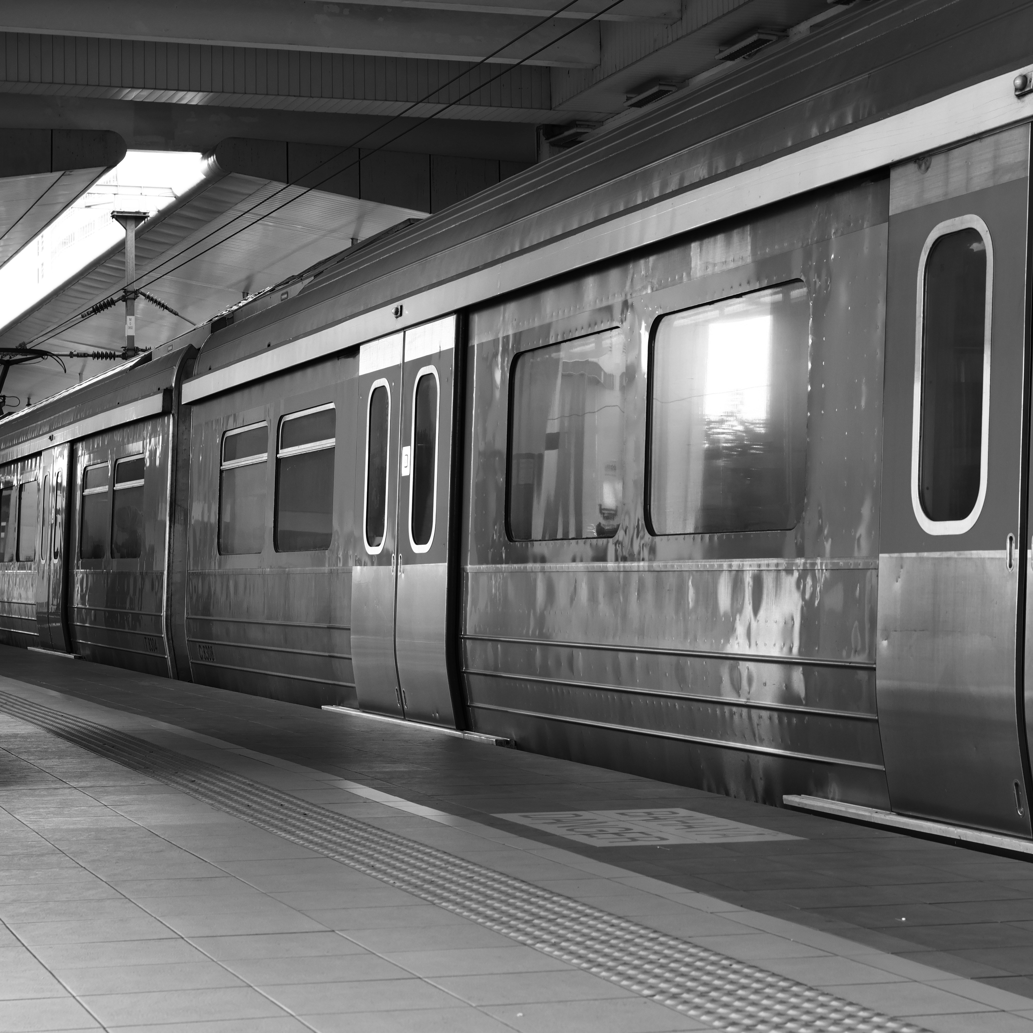 Silent Carriage: A Monochrome Moment on the Platform