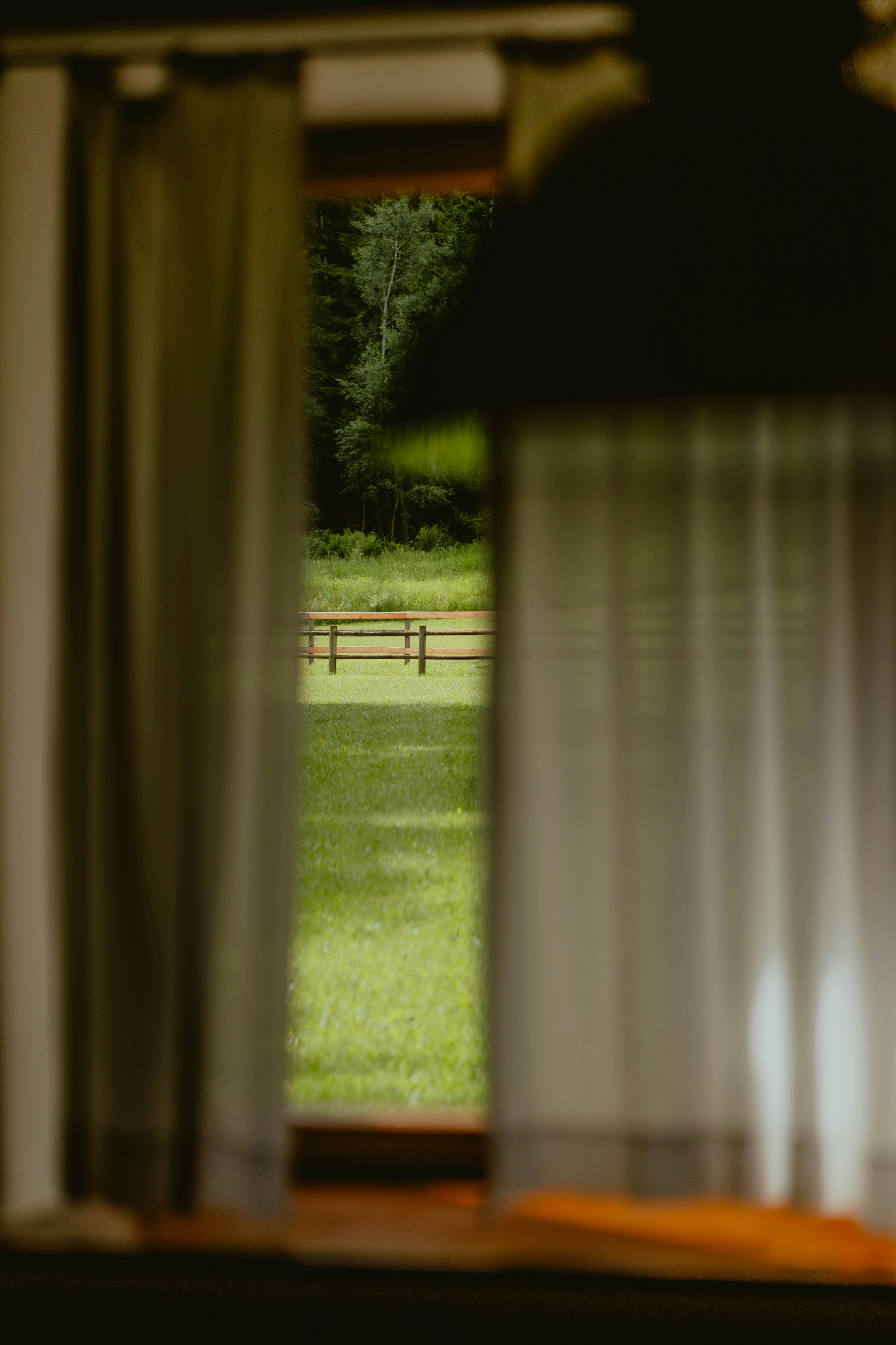 Open View Through a Quiet Doorway to a Sunlit Field