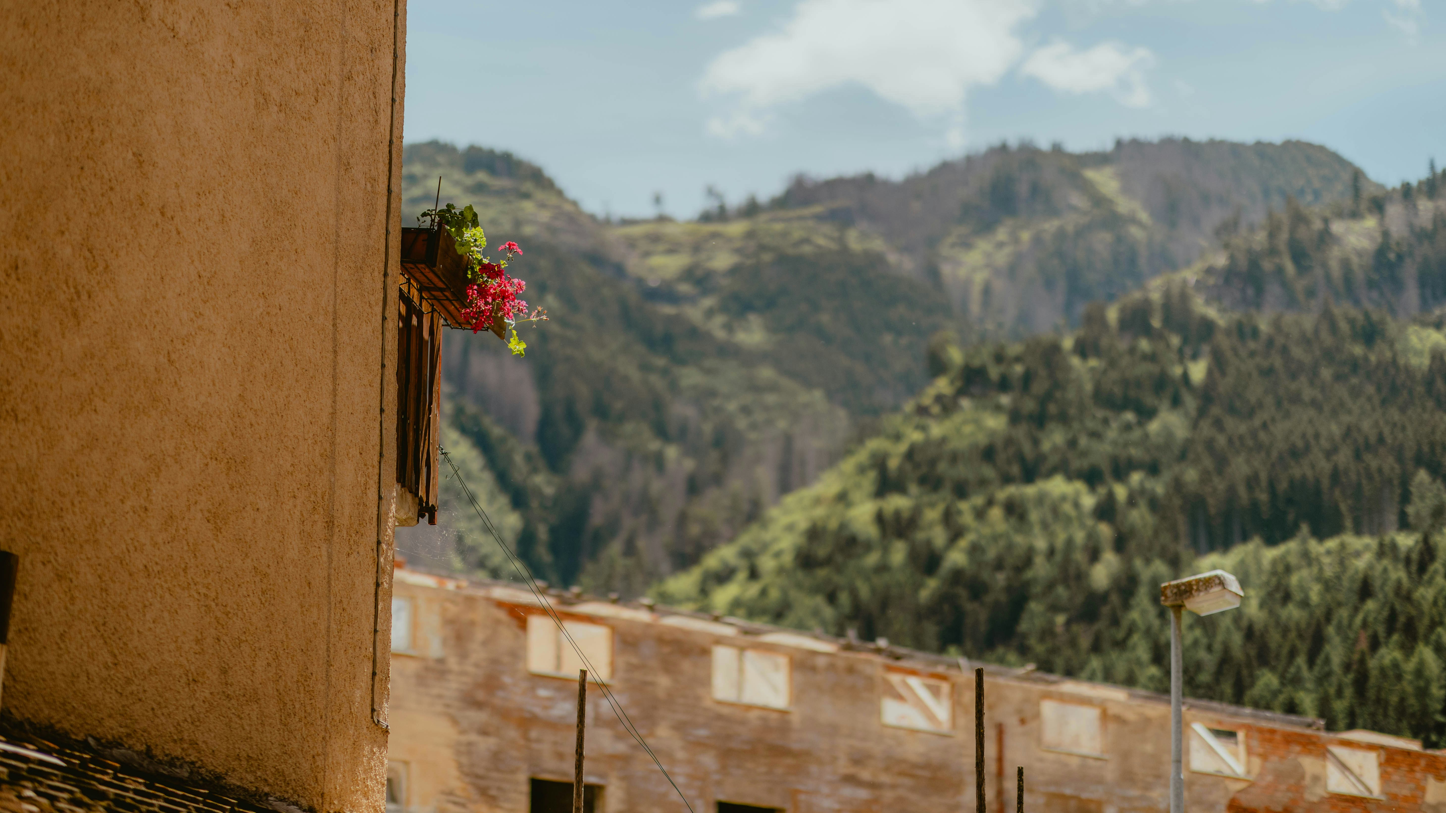 Terracotta Balcony Glow Over Mountain Village