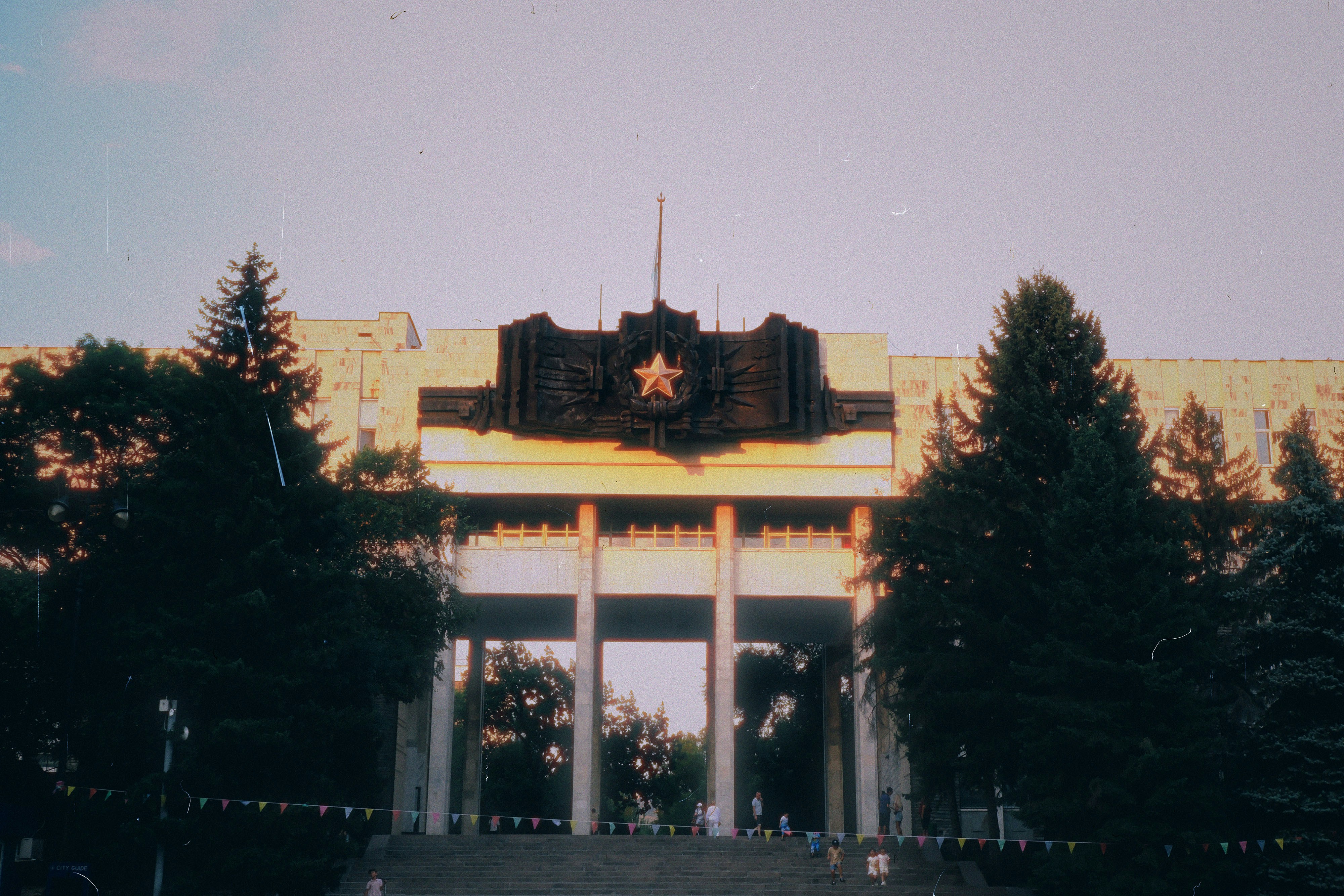 Gate of Echoes: A Soviet Monument Framed by Pines