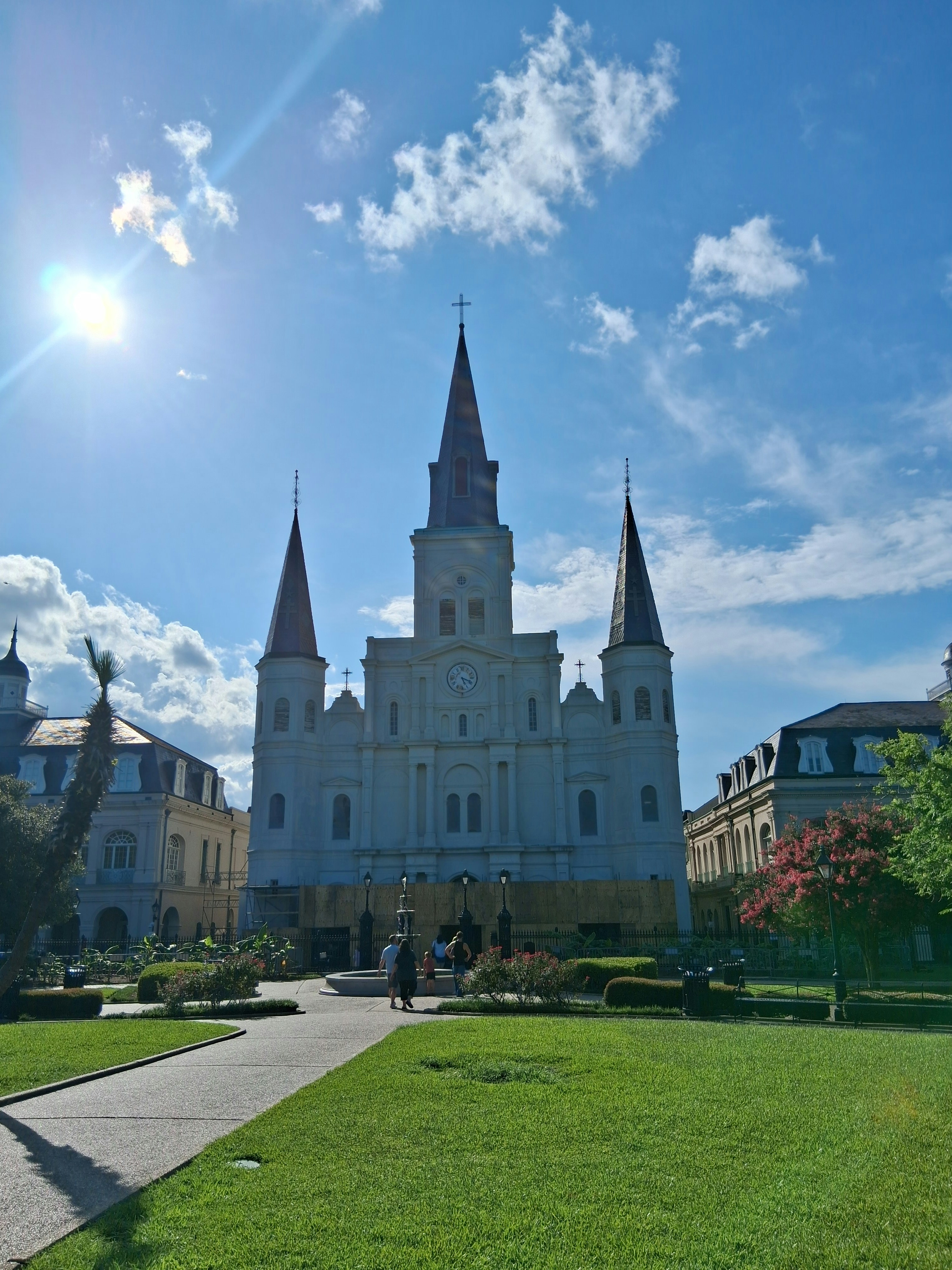 St. Louis Cathedral: Sunlit Twin Spires Guarding a Green Courtyard