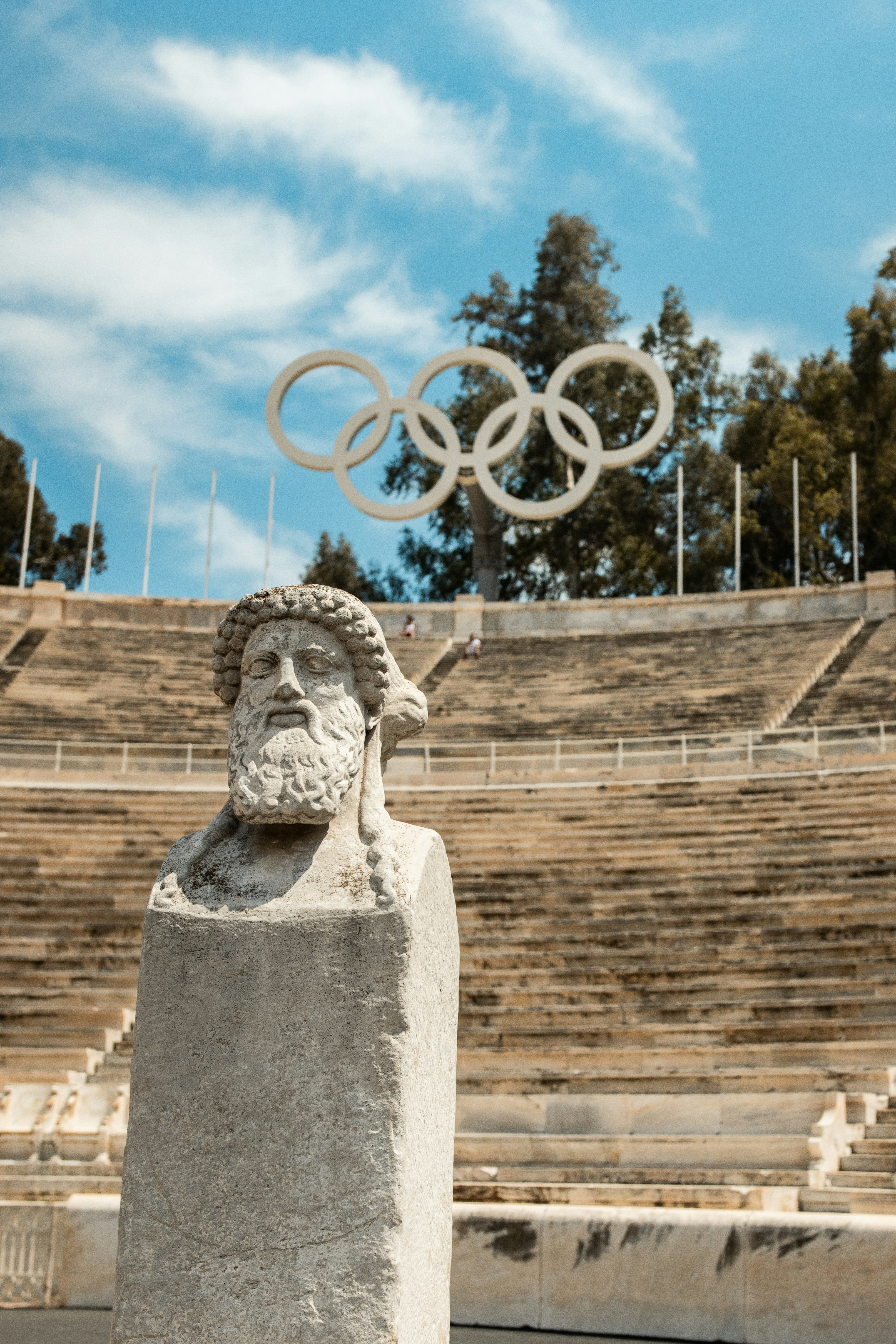 Olympic Echoes: A Stone Oracle Beneath Concentric Rings