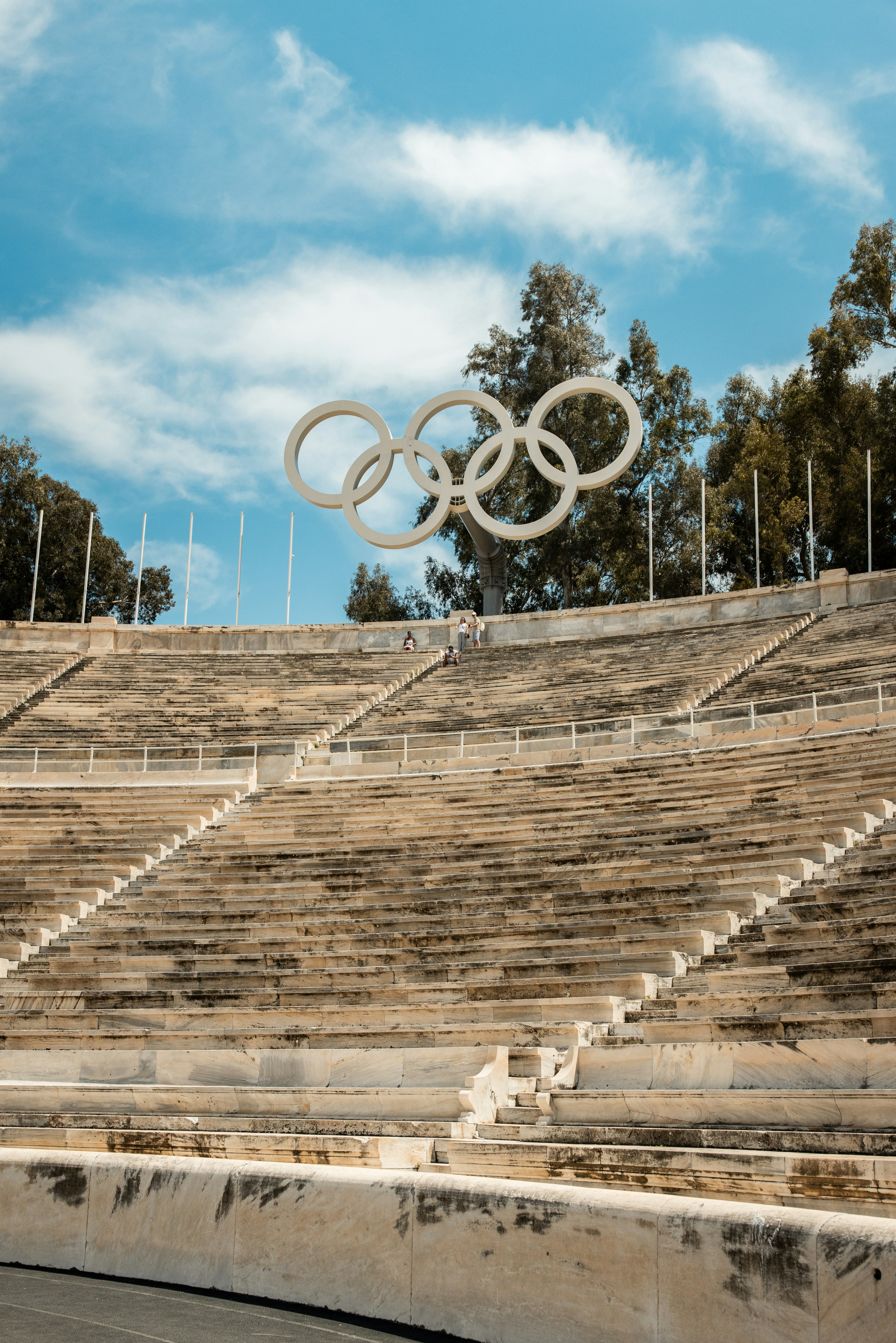 Olympic Rings Over Silent Seating at Dusk
