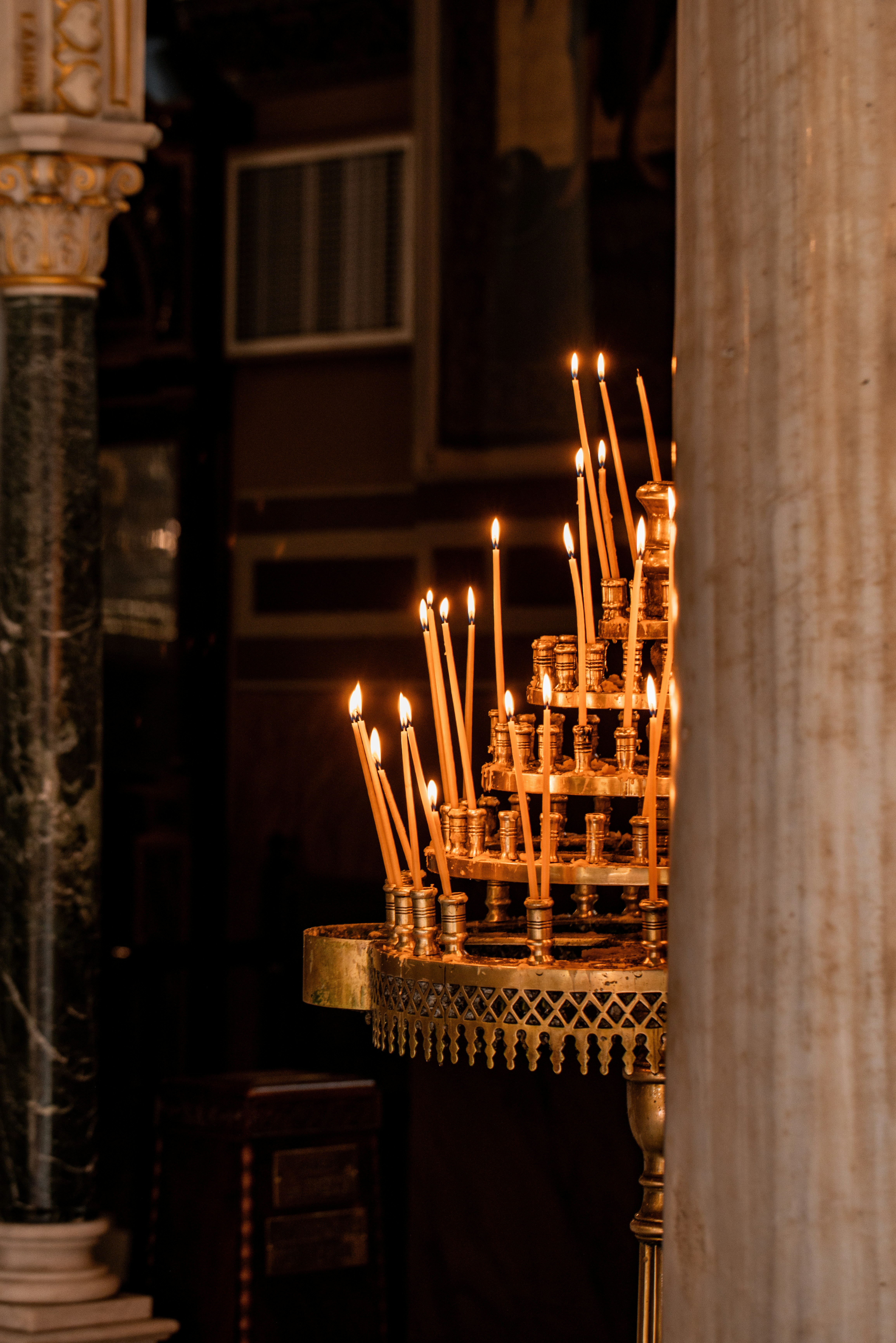 Candlelit Shrine: A Row of Faithful Flames in a Dim Cathedral
