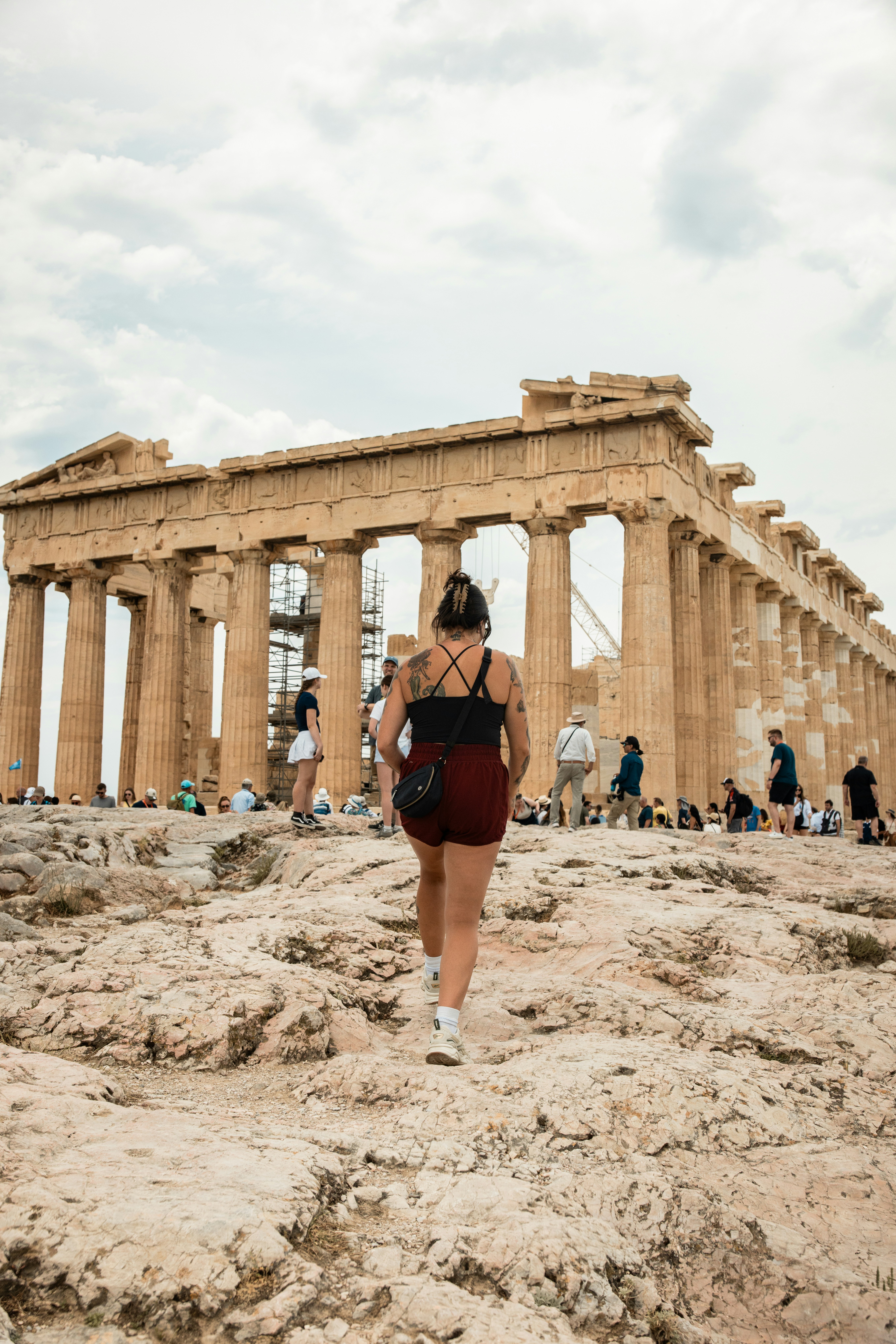 Traveler’s Path to the Parthenon: A Lone Wanderer Among Ancient Columns