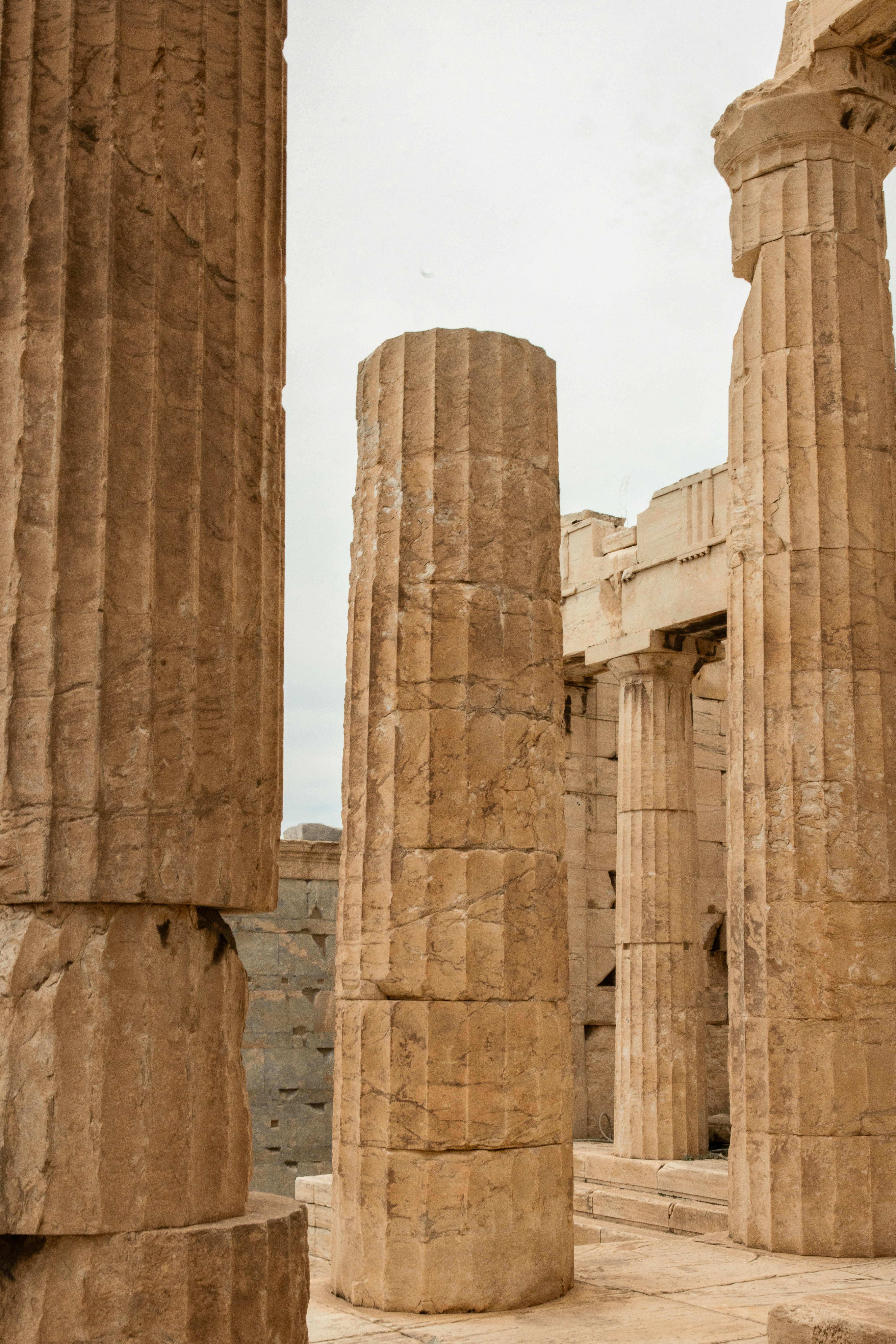 Ancient Columns Rise: Sunset over Distant Ruins in Stone Halls