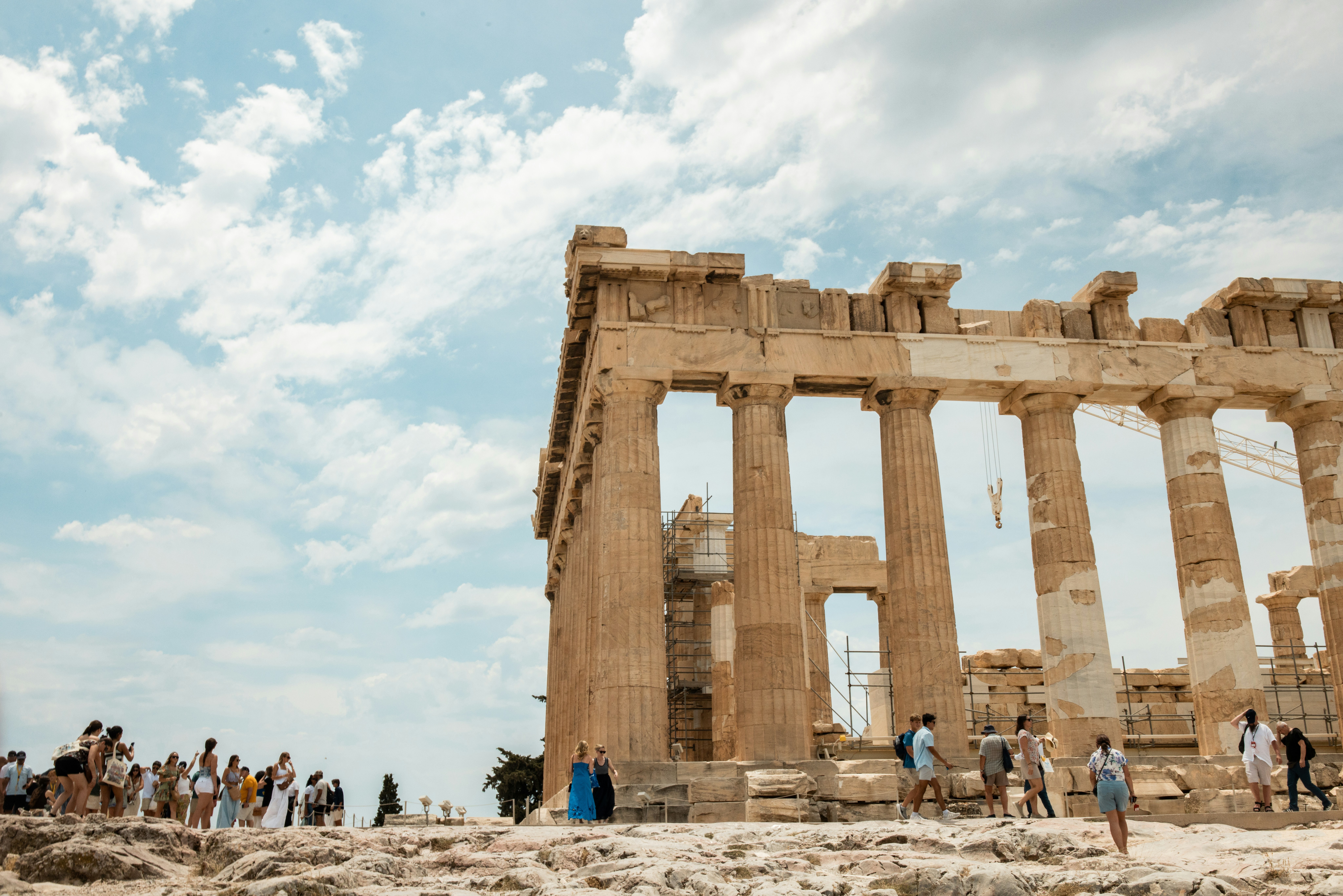 Ancient Columns and Flock of Visitors at Sunset Parthenon