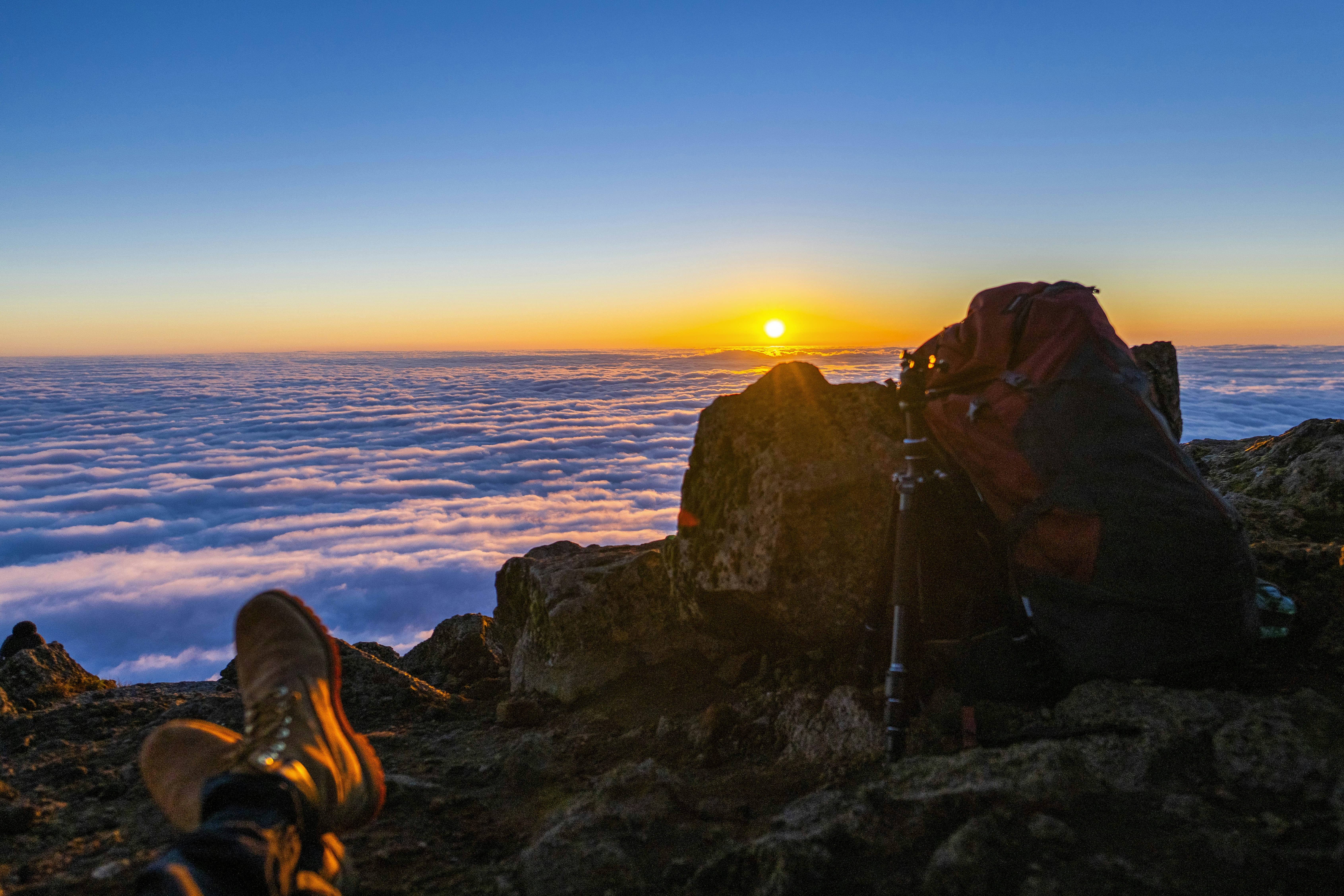 Sunrise Over the Edge: Boots, Rock, and the Quiet Horizon
