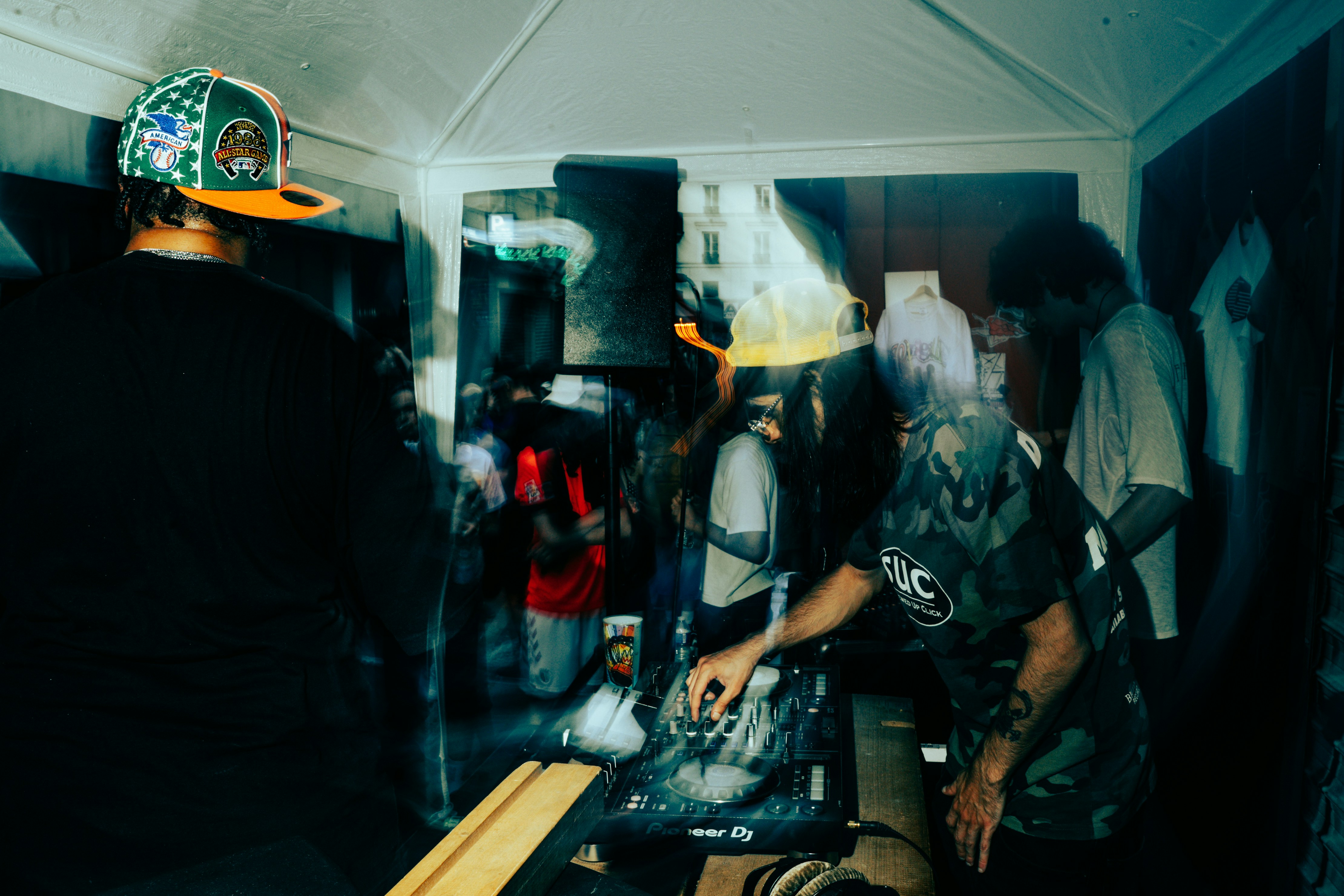 DJ in the Neon Quiet: Nightclub Pulse Behind a Curtain of Glass