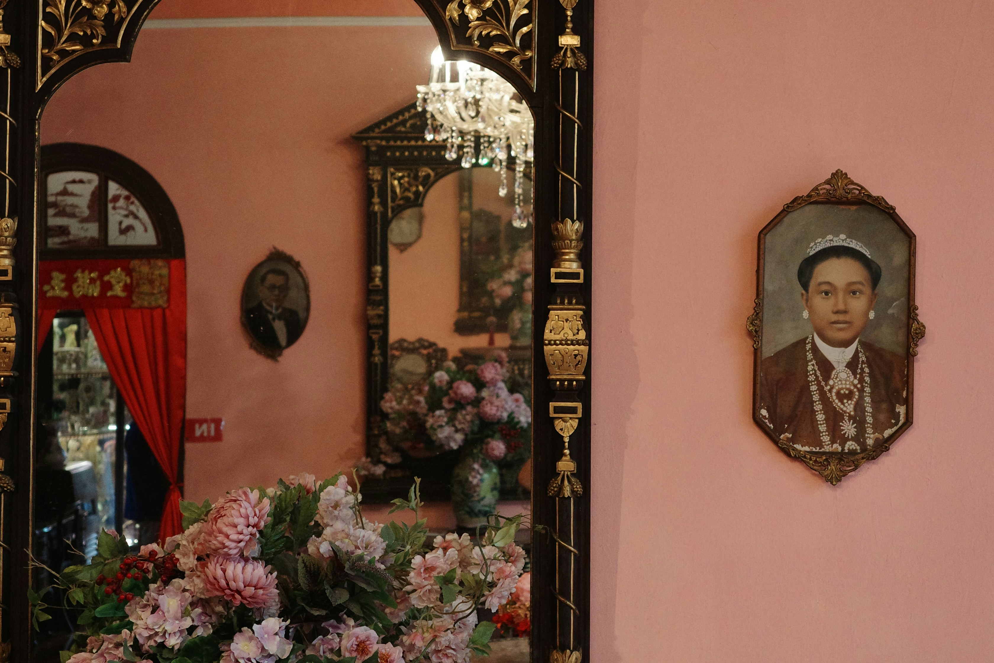 Pastel Shrine: A Floral Still Life Reflected in Ornate Arch