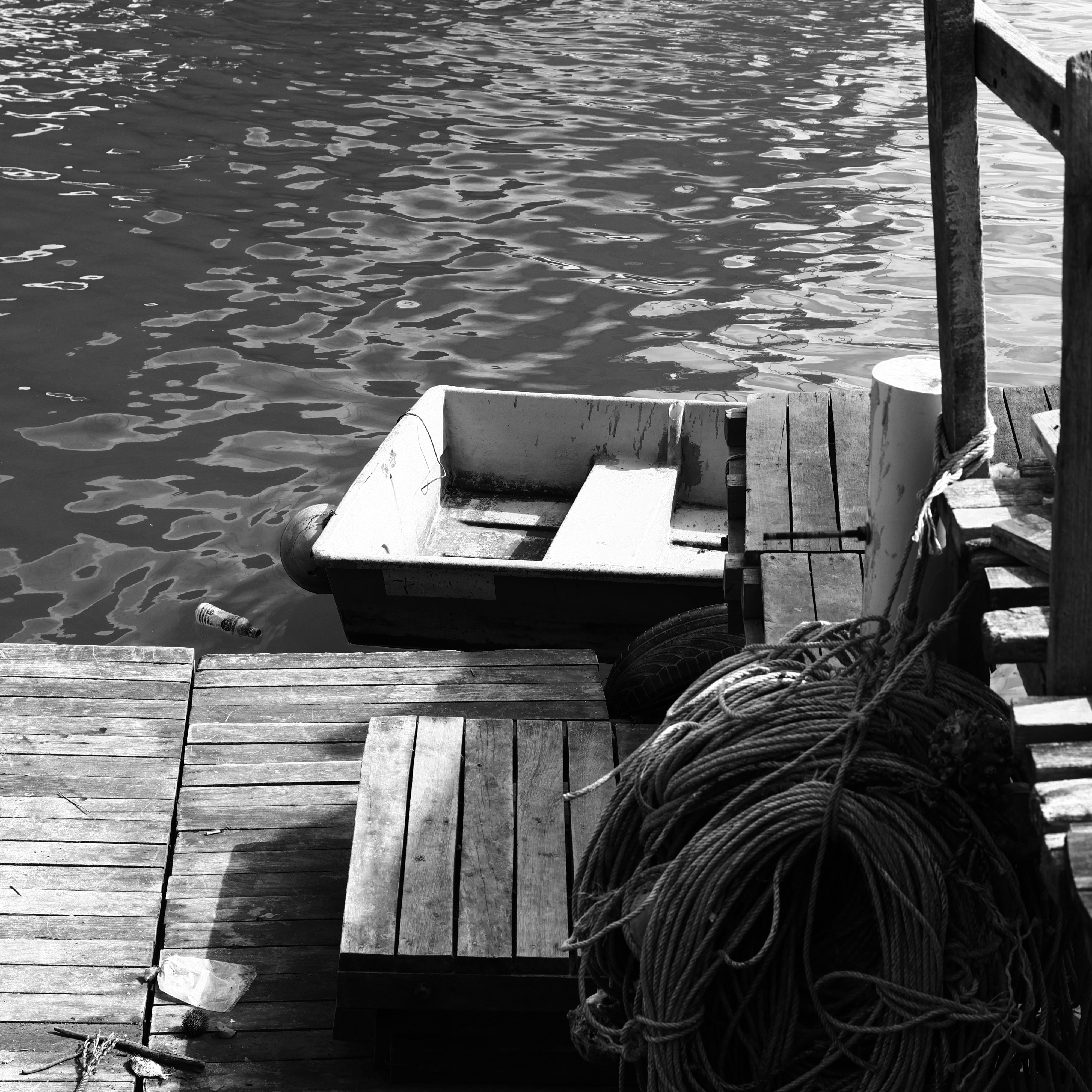 Rope, Wood, and Water: A Quiet Dockside Moment in Monochrome