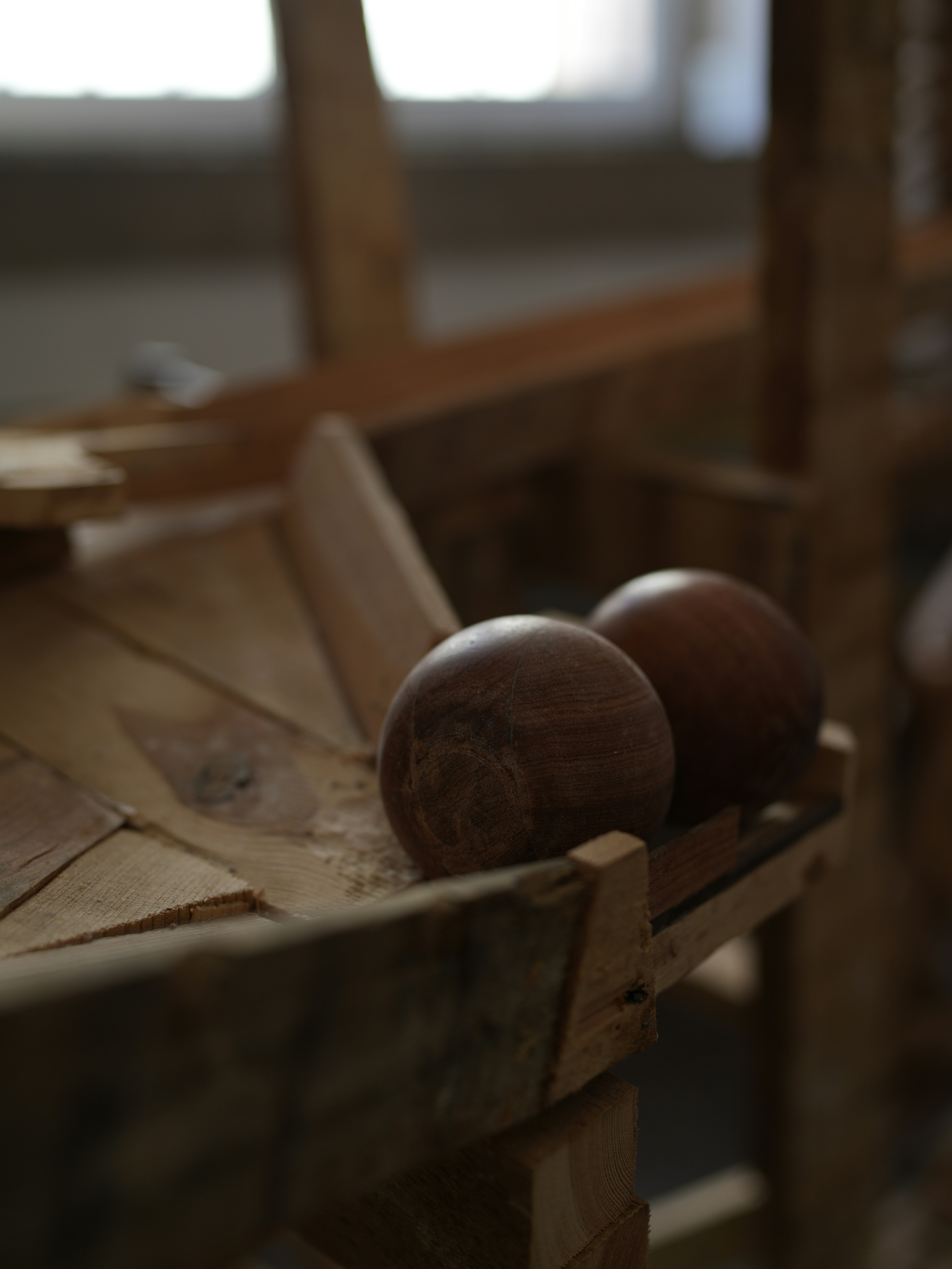 Wooden Balls on a Workbench: Quiet Craft in Soft Light